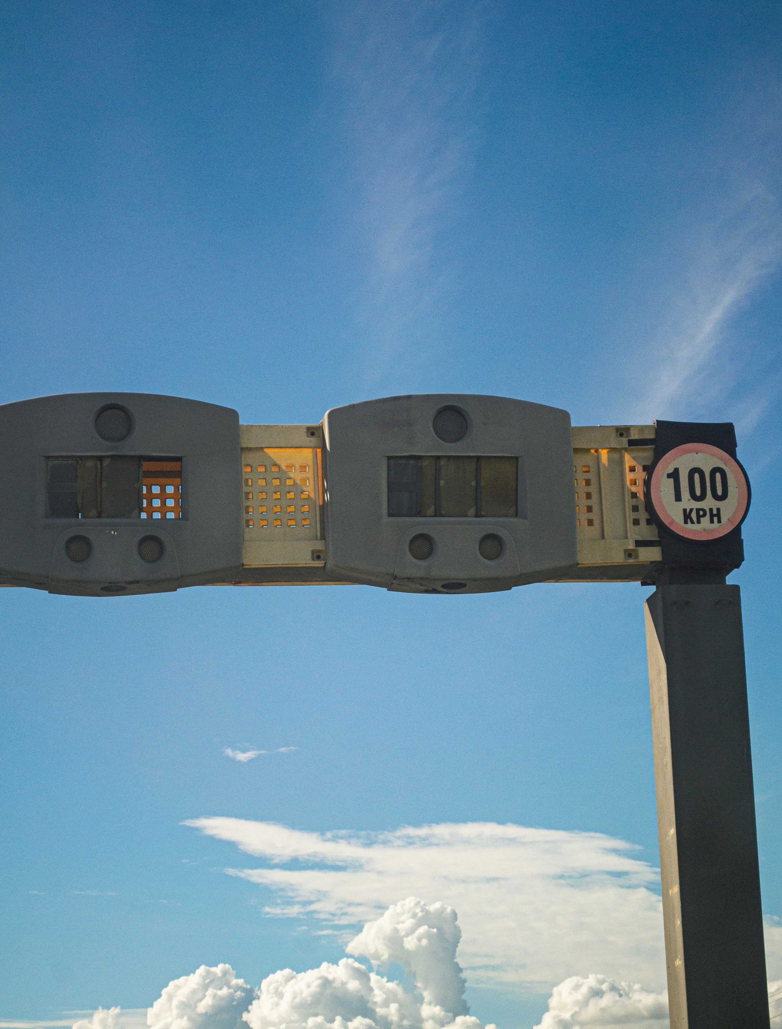 Overhead highway sign displaying the speed limit. photo – Free Clouds ...