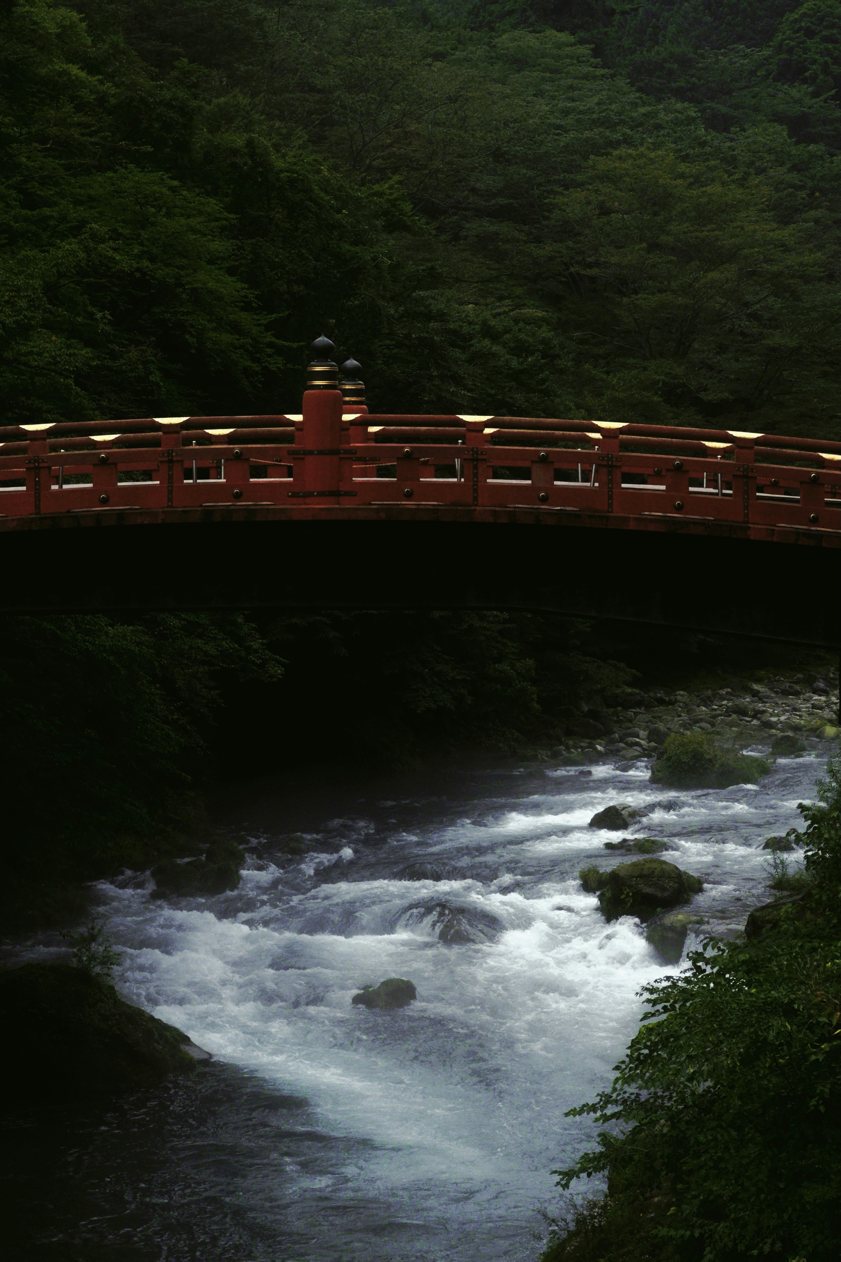 A red bridge crosses over a rushing river. photo – Free Forest Image on ...