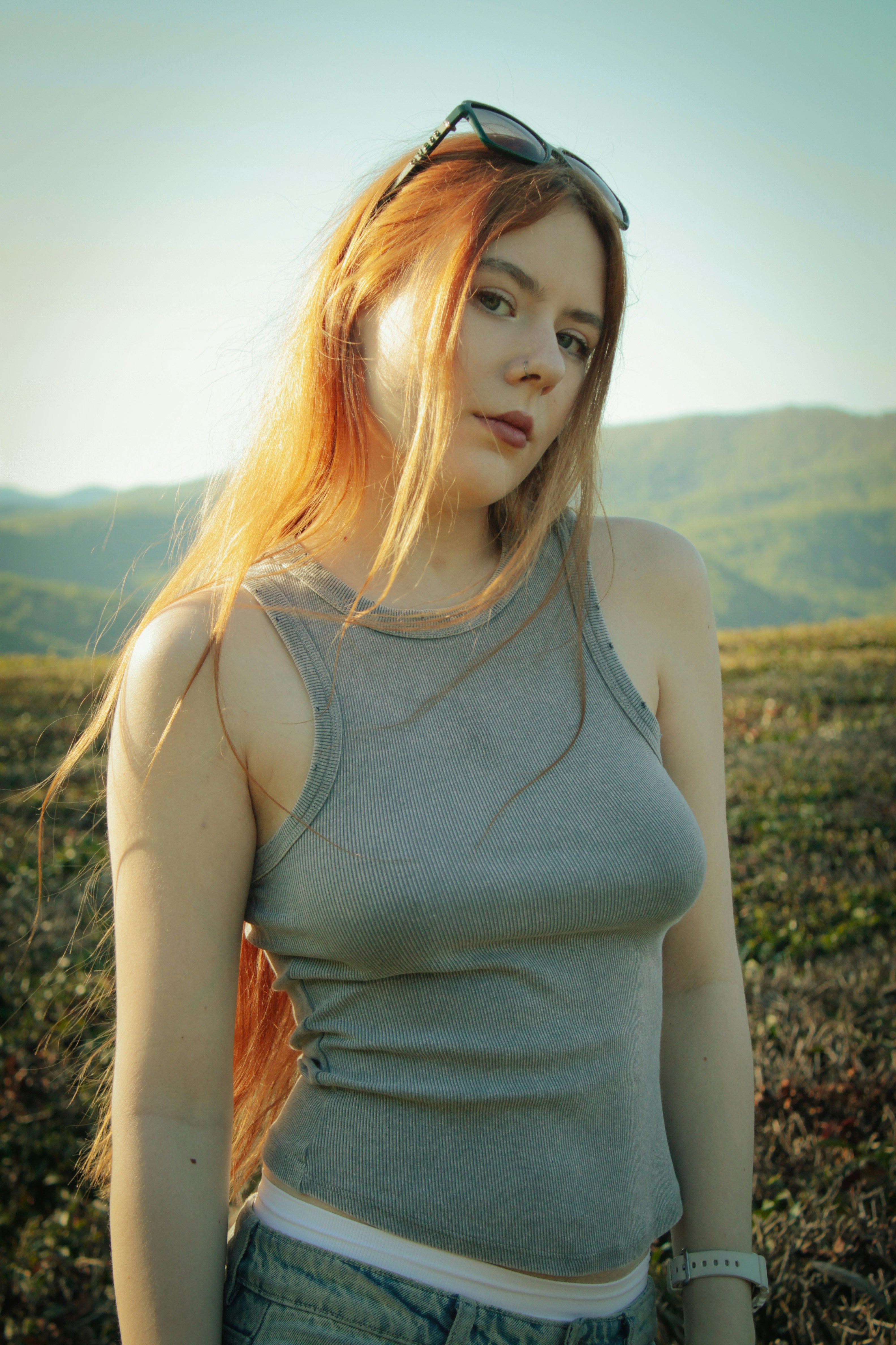 Sunlit Verve: Portrait of a carefree gaze beneath amber hair