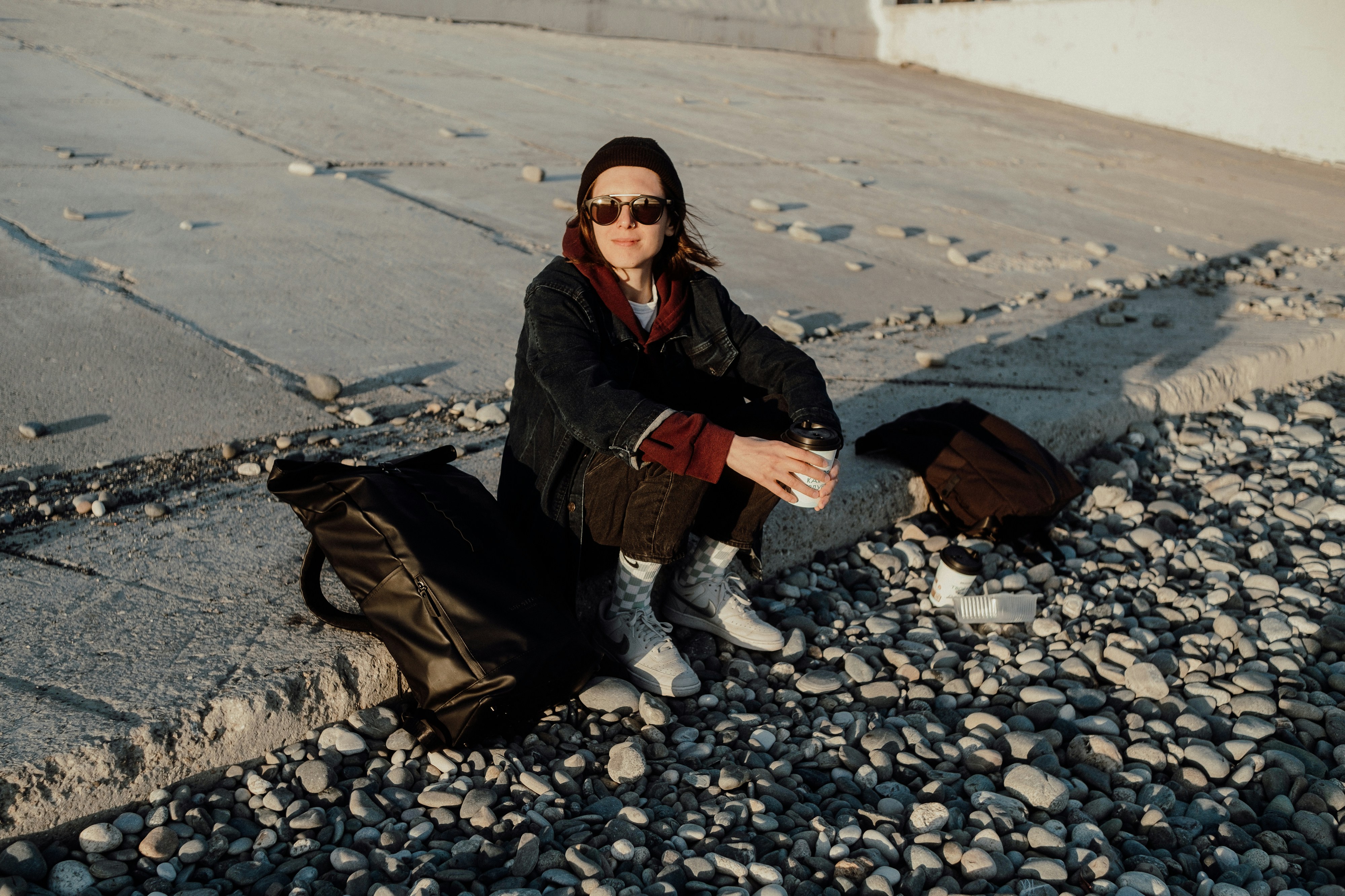 Pebble Ground Portrait: Quiet Confidence in Sunlit Texture