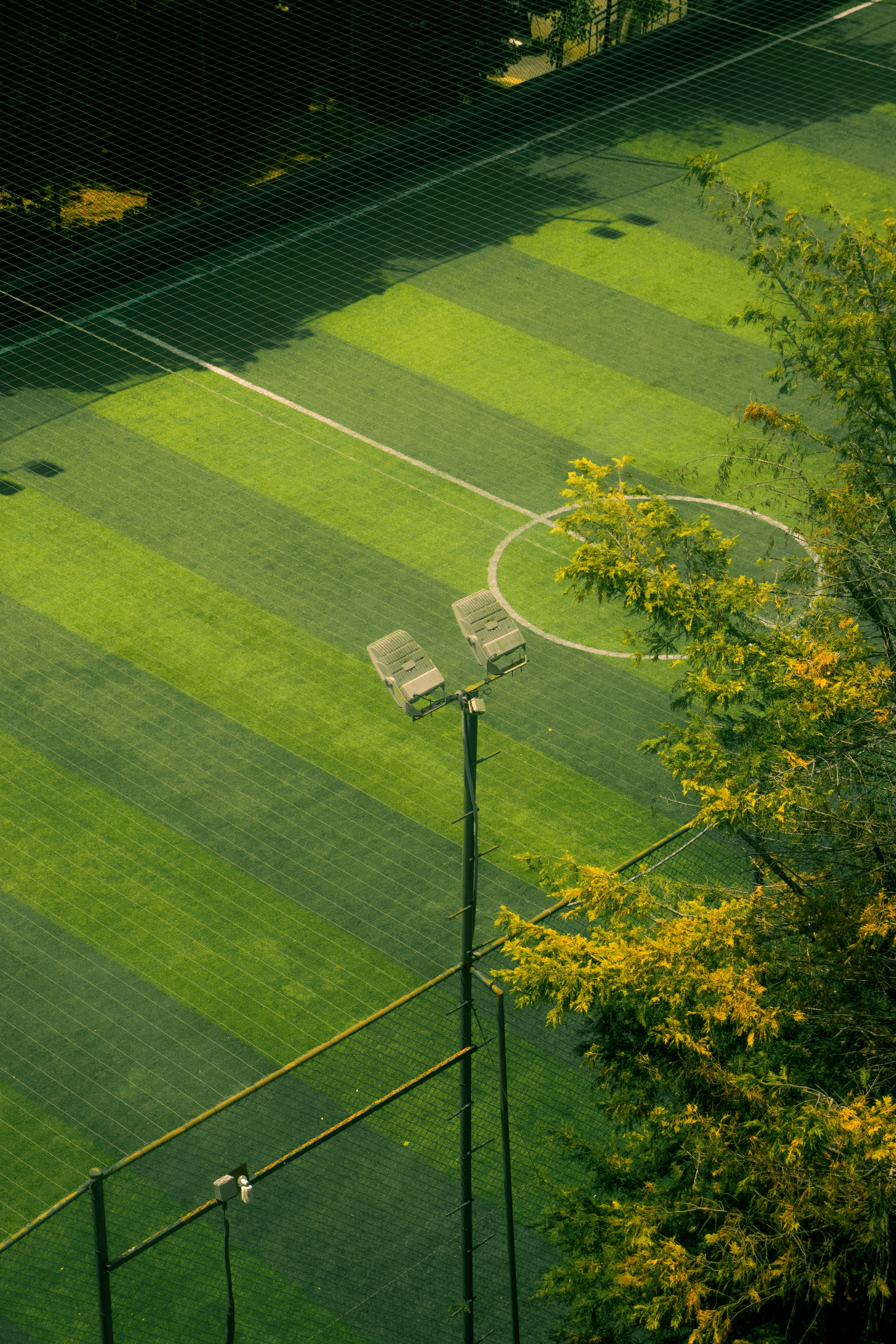 Center Circle, Striped Turf, and Quiet Floodlights: An Aerial Field Portrait