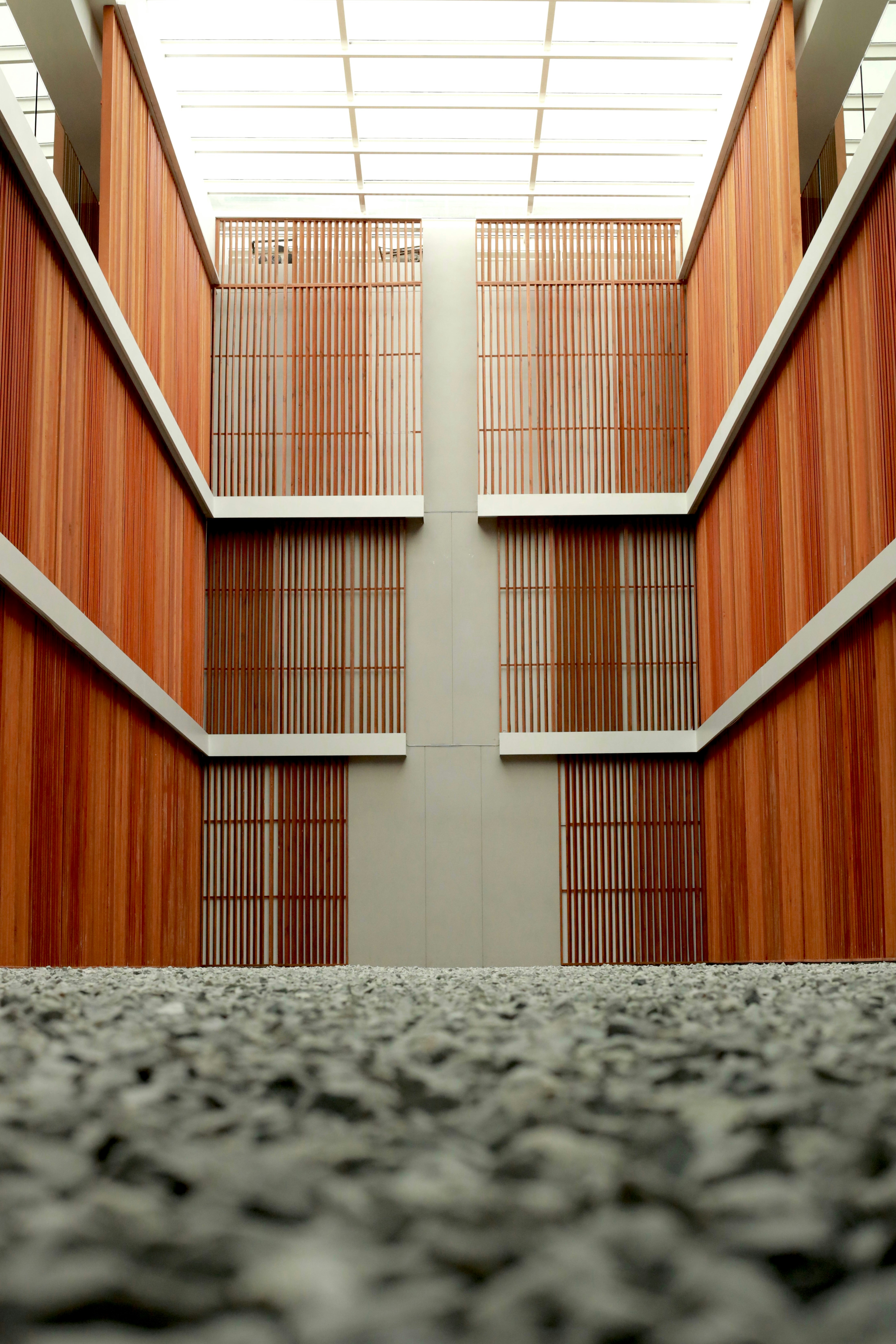 Wooden panels line an architectural corridor. photo – Free Building ...