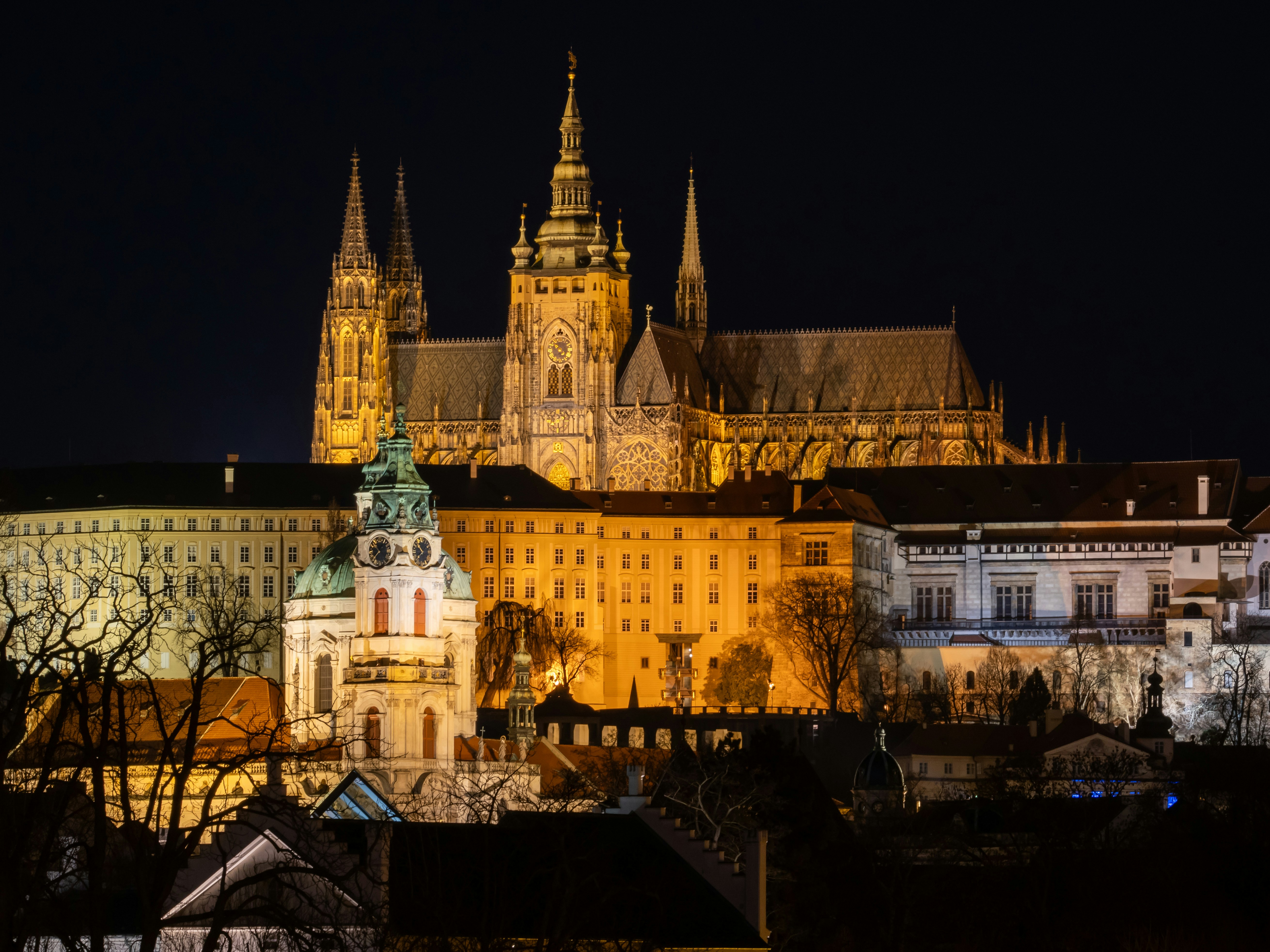 Prague castle illuminated at night.
