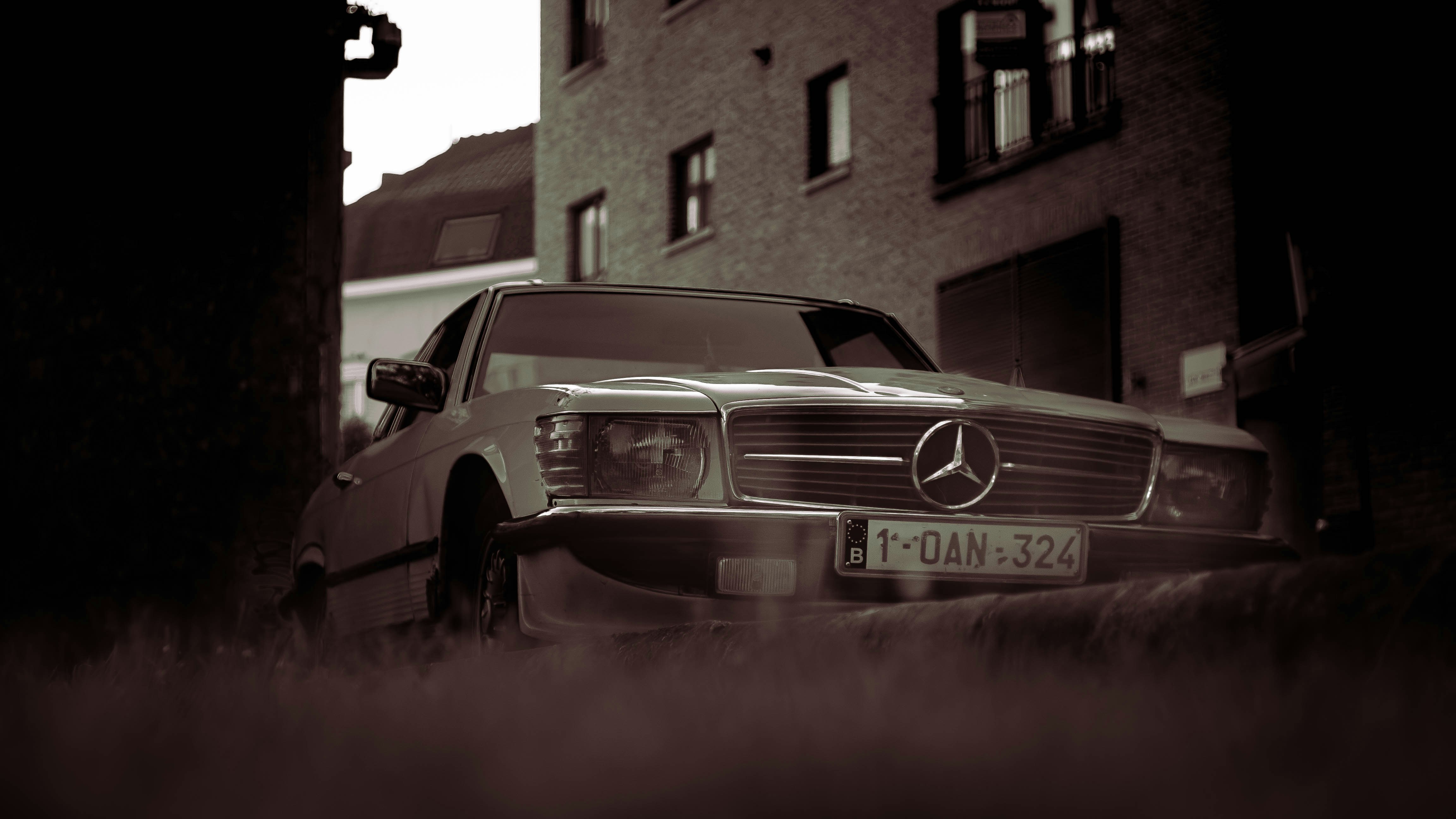 A vintage mercedes benz is parked near a building. photo – Free Car ...