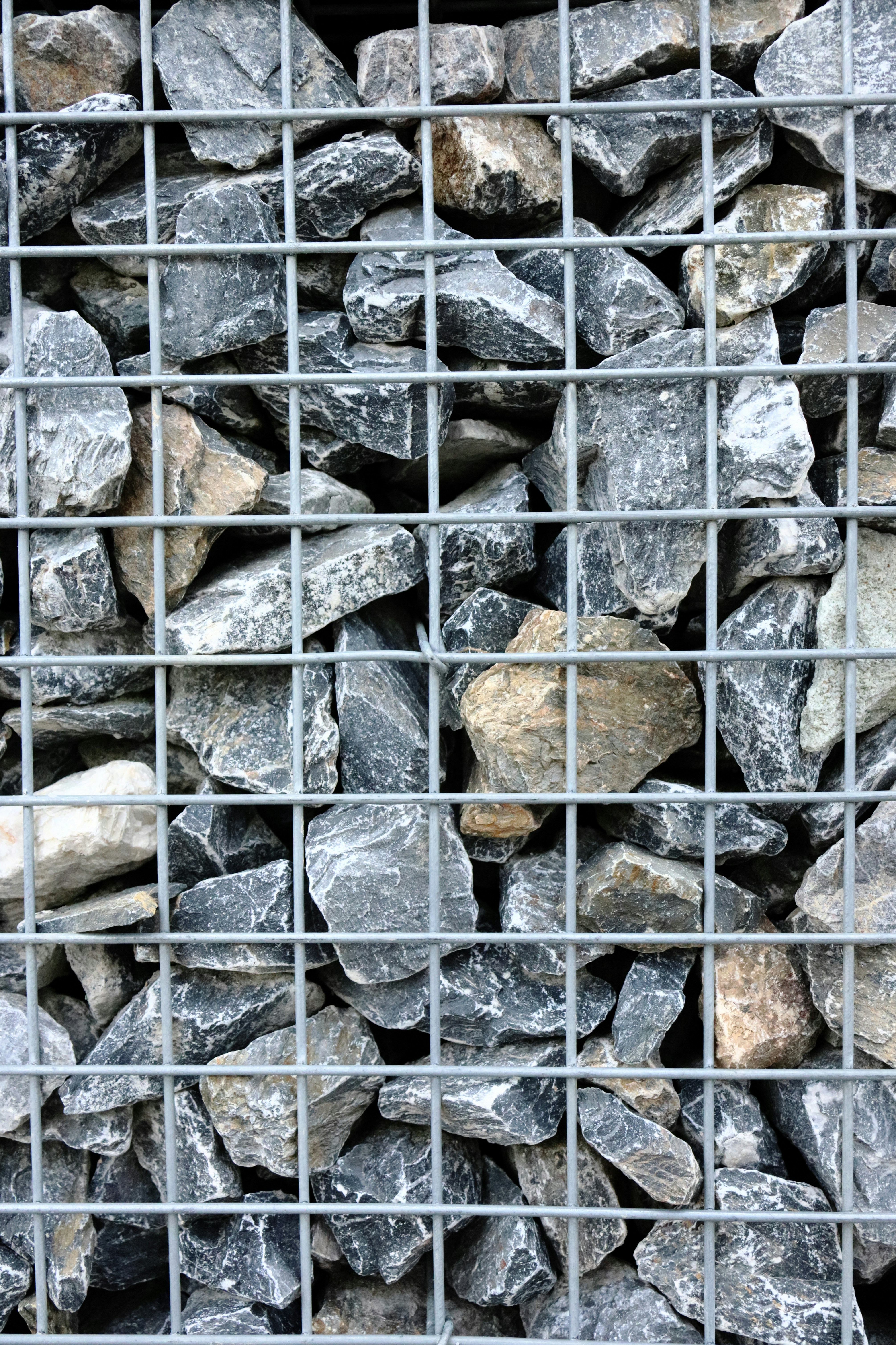 Rocks are held securely in a wire mesh. photo – Free Rocks Image on ...