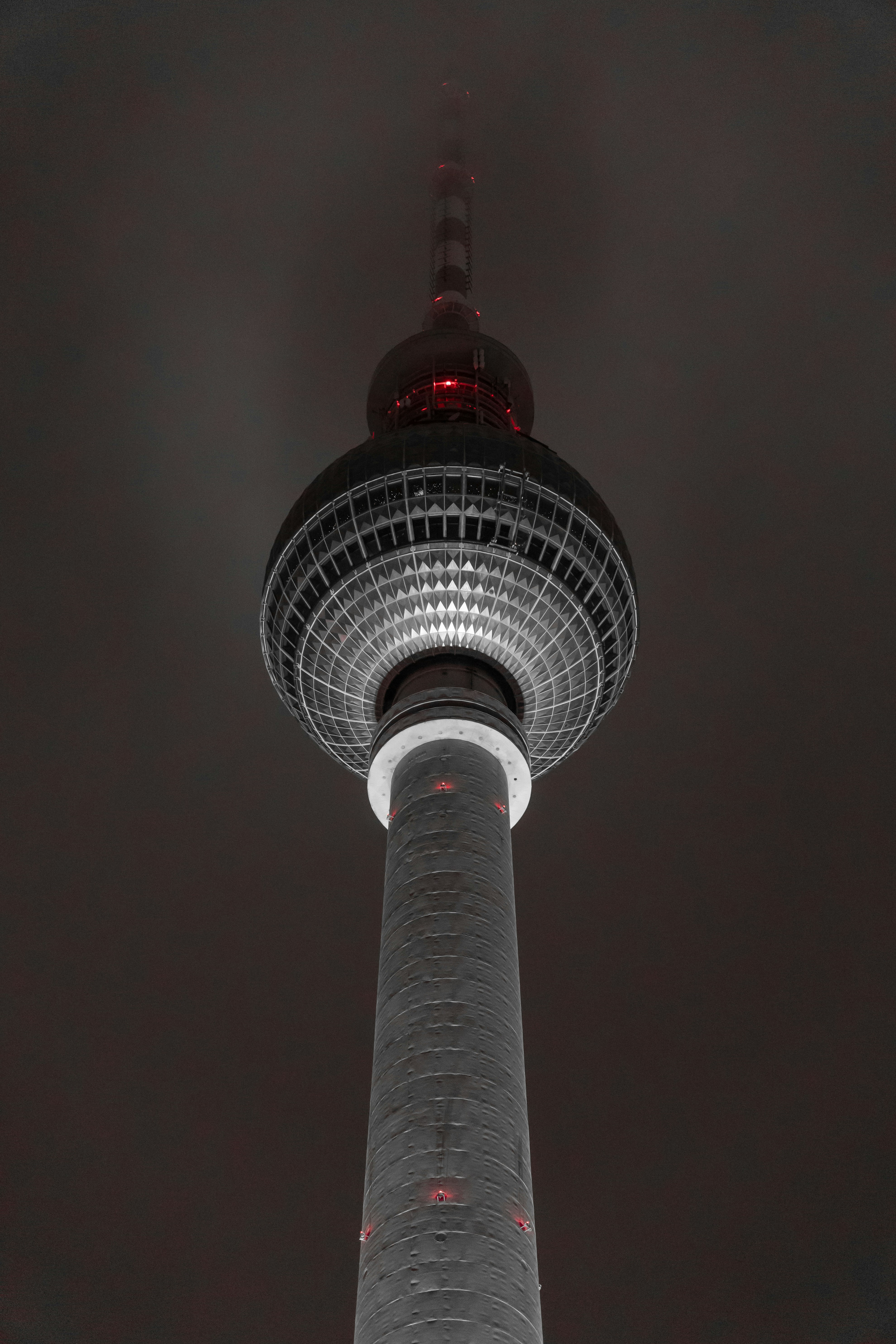 Berlin's Night Beacon: The Fernsehturm's Illuminated Sphere Reaching Skyward