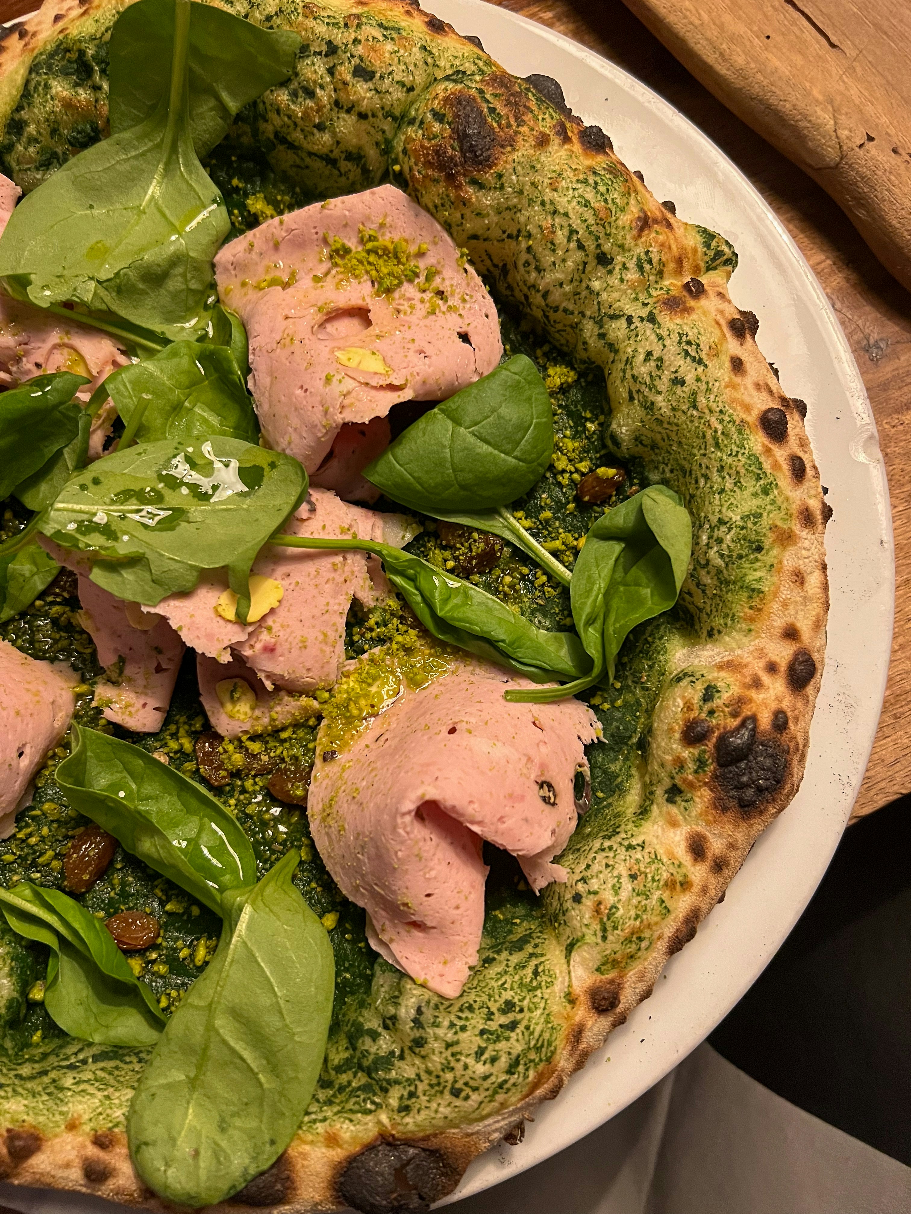 Herbed Pistachio Crust Pizza with Pink Roast Pork and Fresh Greens