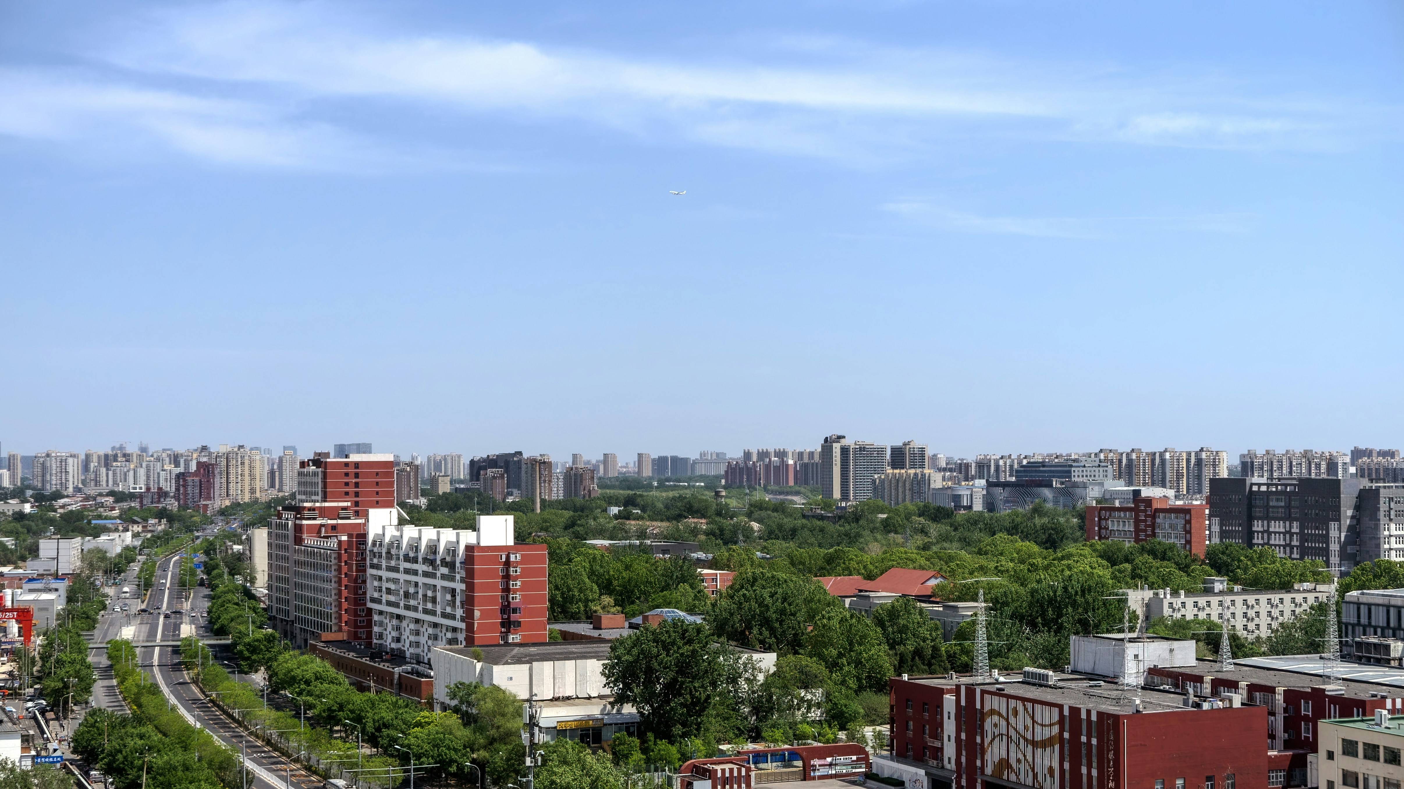 Cityscape with buildings under a blue sky.