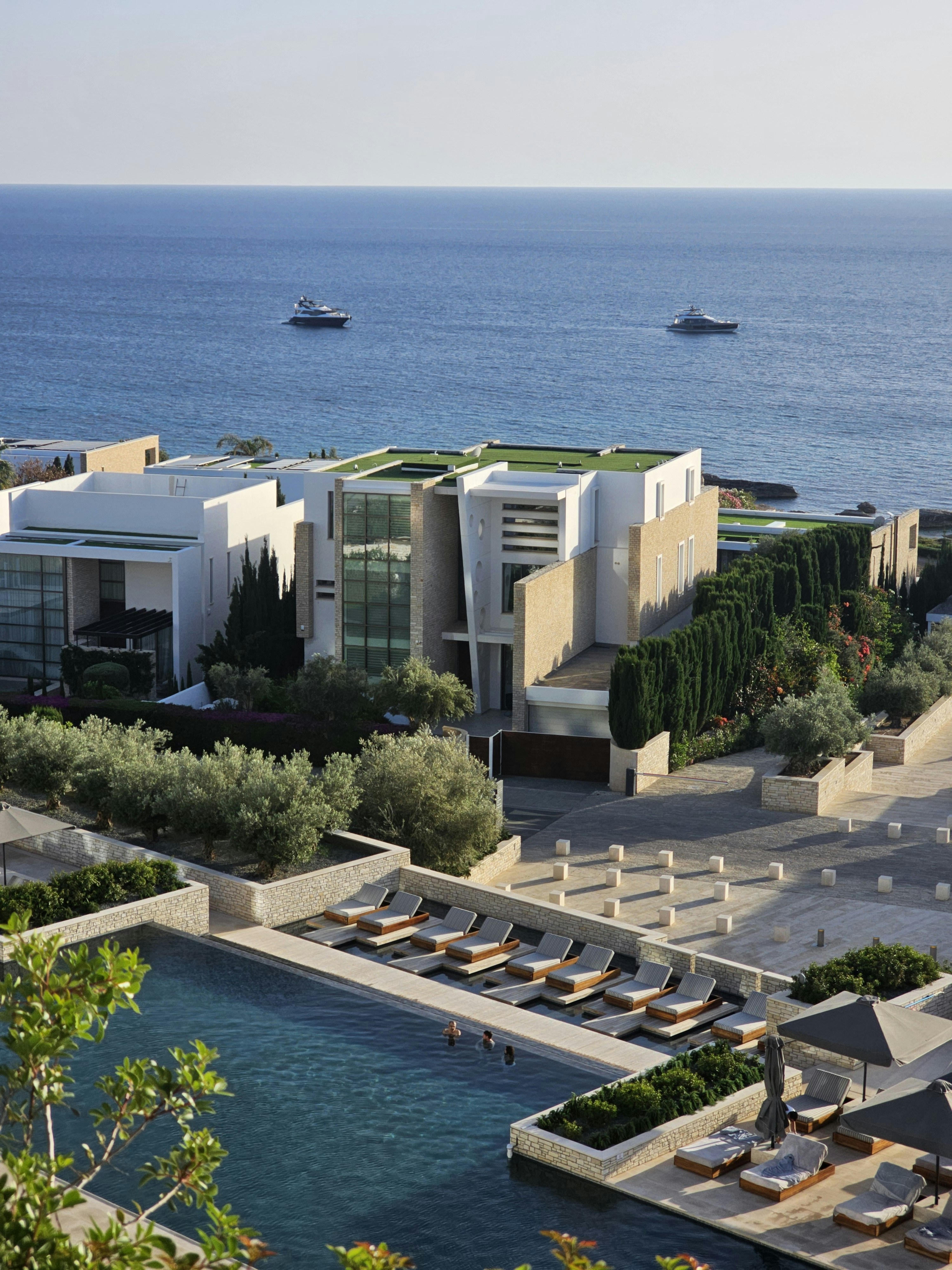 Luxurious seaside villas overlook a serene ocean view. photo – Free ...
