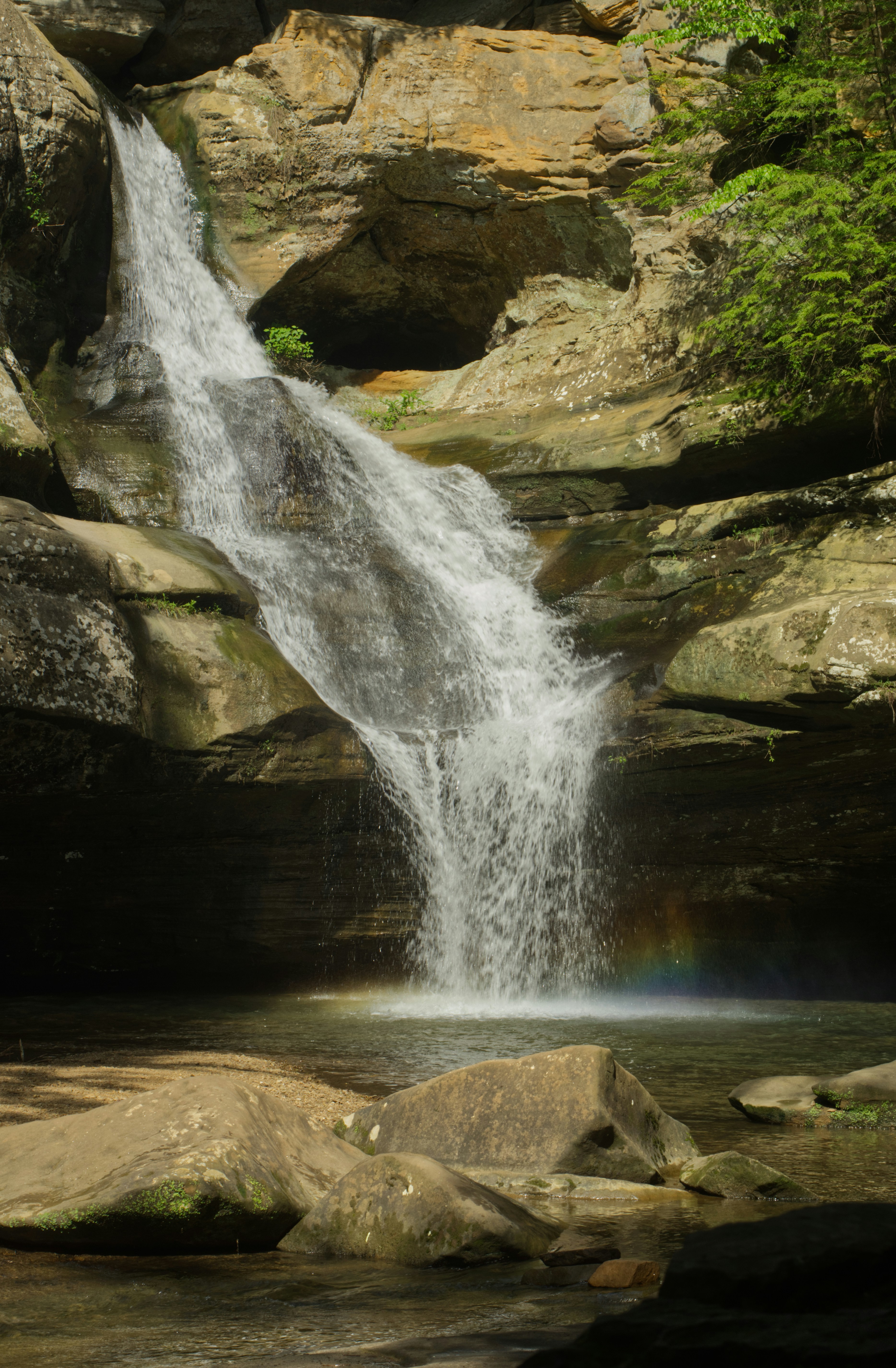A beautiful waterfall cascades into a rocky pool. photo – Free ...