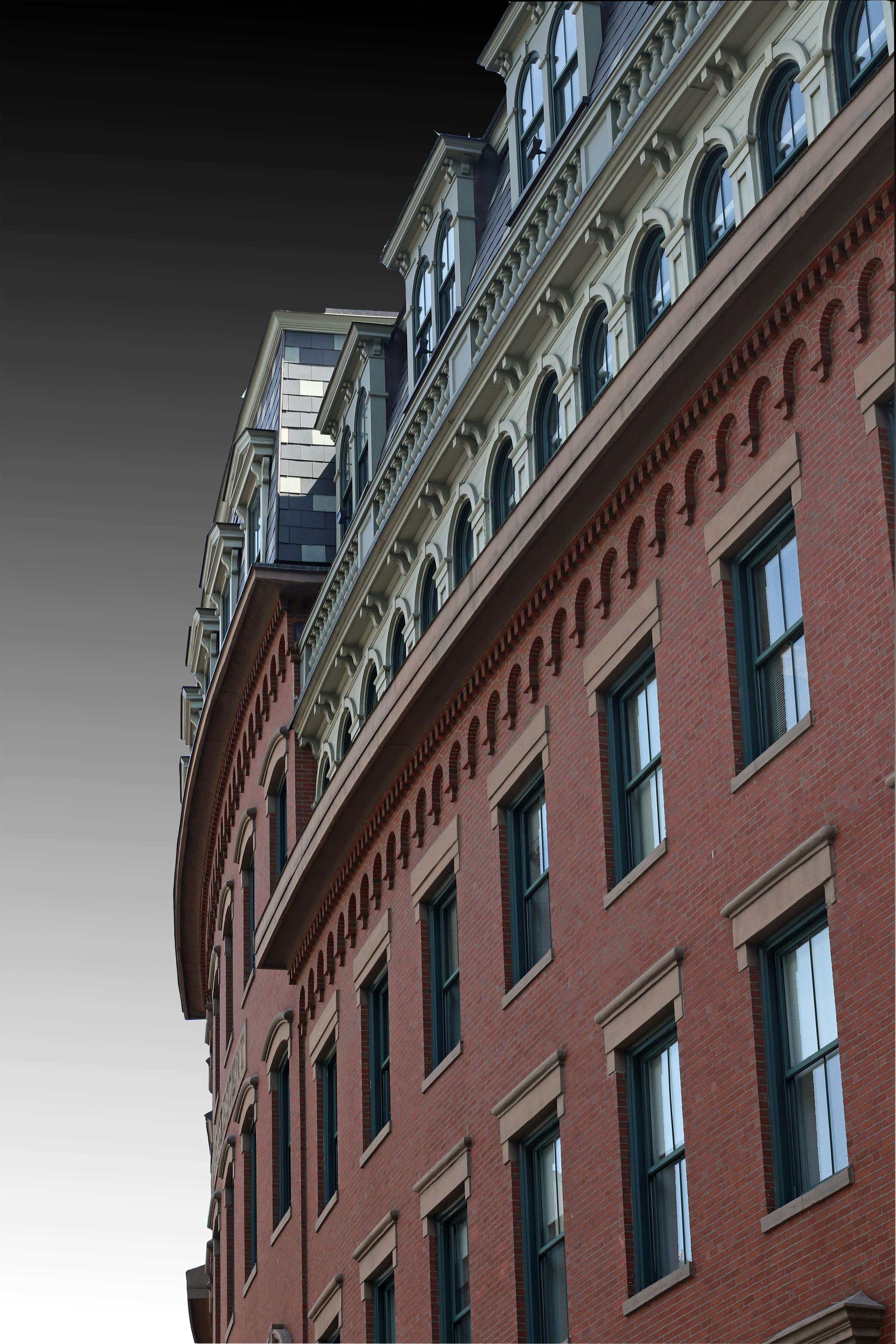 A brick building with a distinct architectural style. photo – Free ...