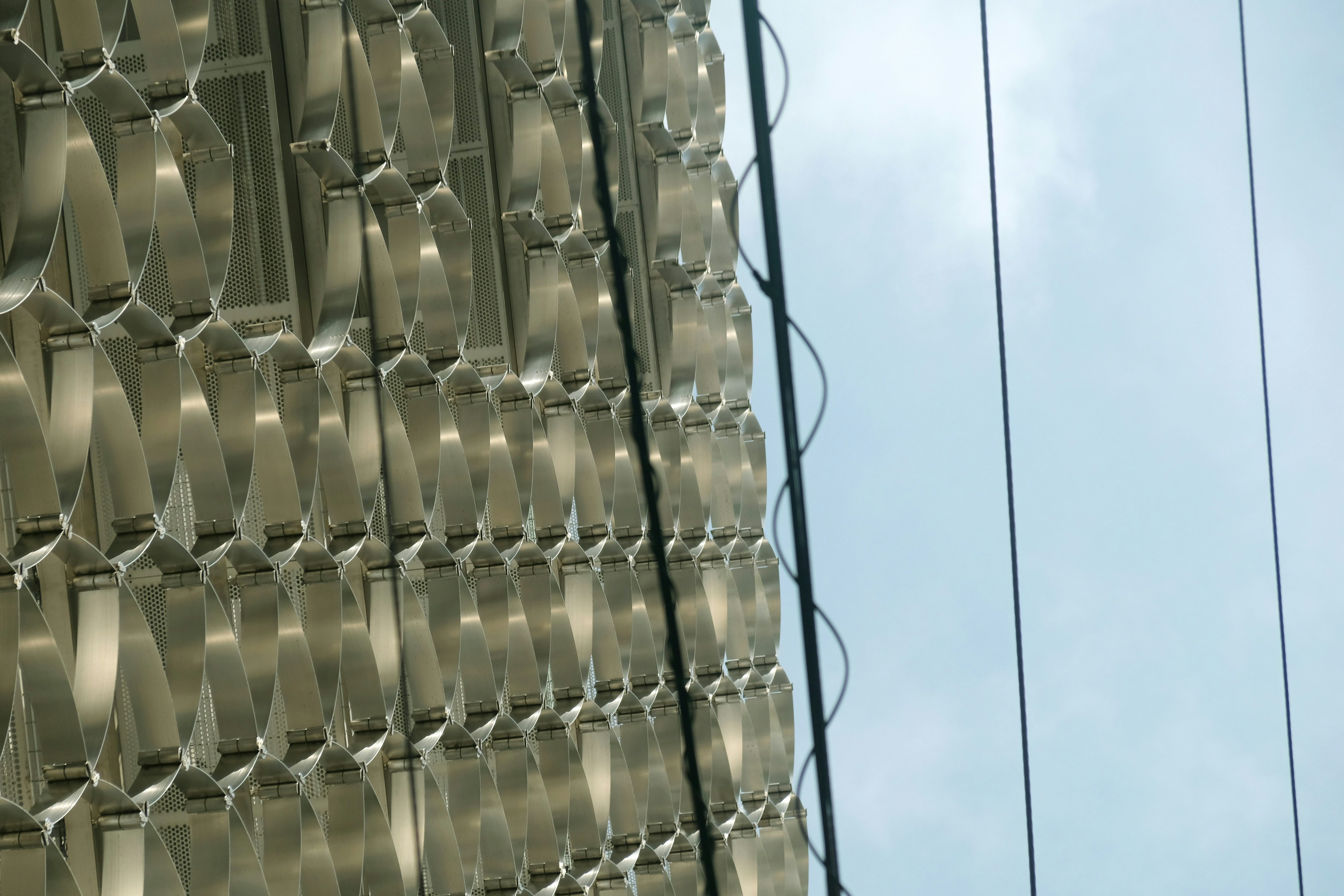 Facade Geometry: Repeating Cells and Vertical Clares Against a Clear Sky