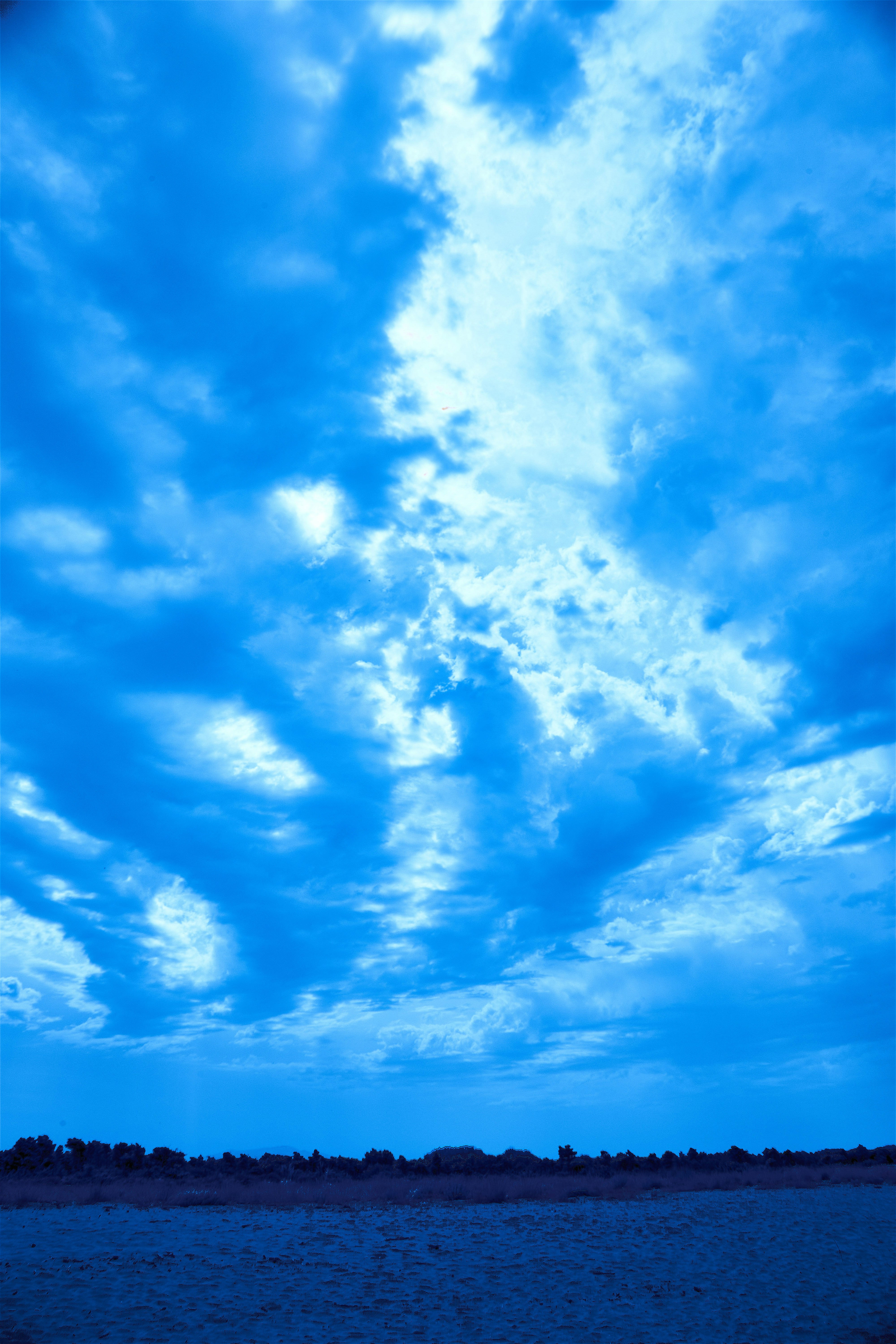 Azure Veil Over the Quiet Shoreline