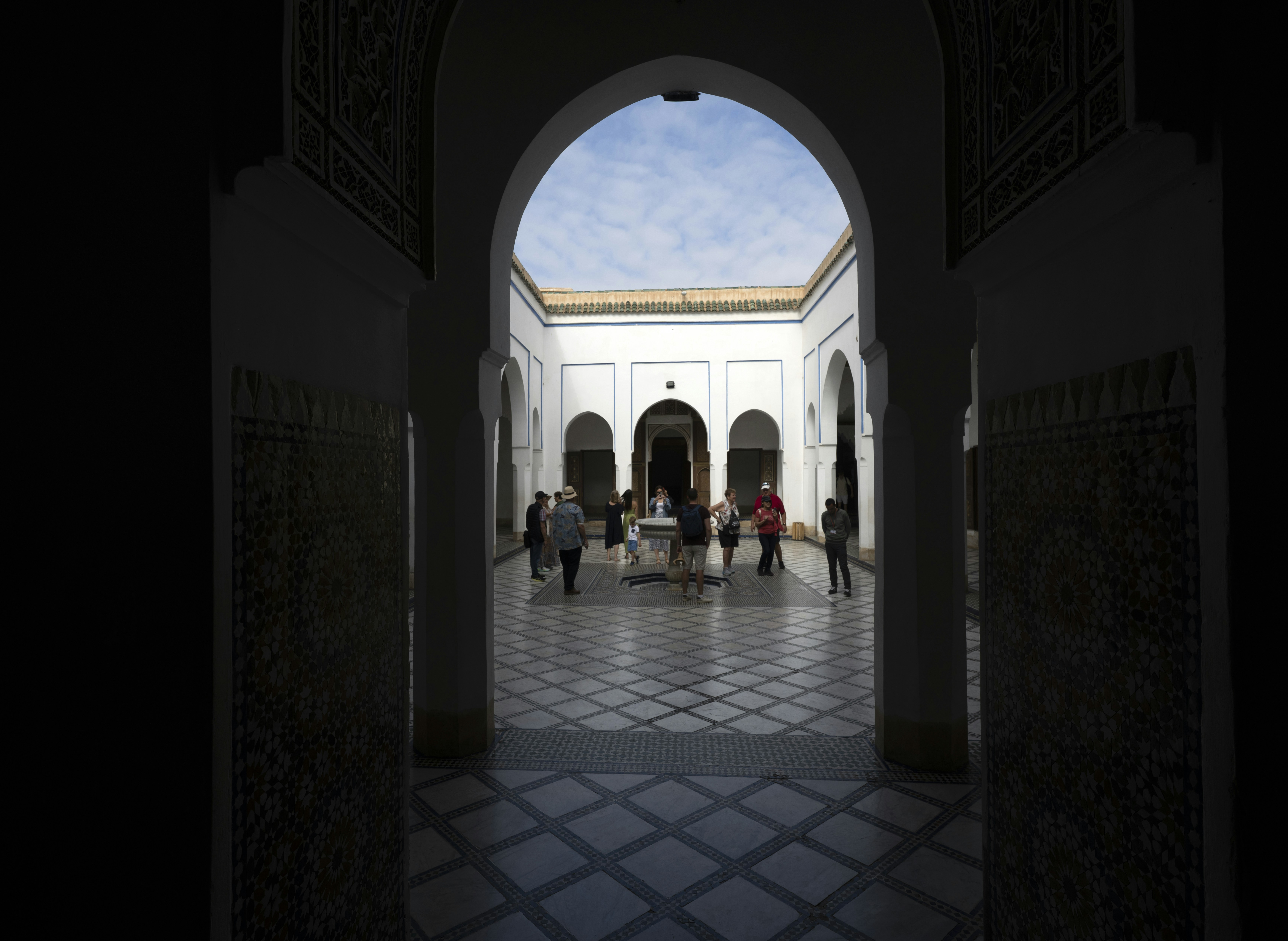 Arched doorway looks out onto a courtyard.