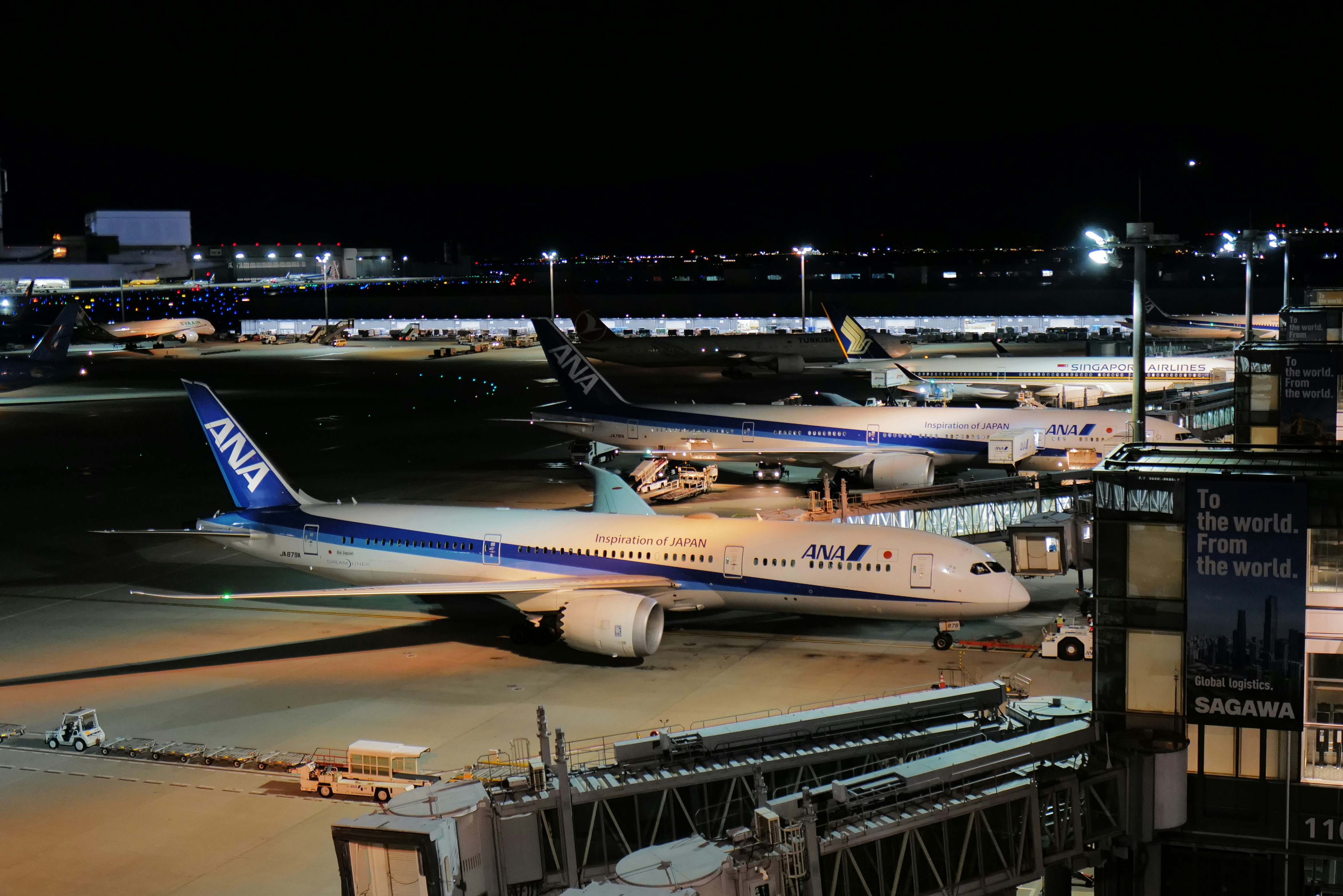 Airplanes are parked at the airport at night. photo – Free Airplane ...