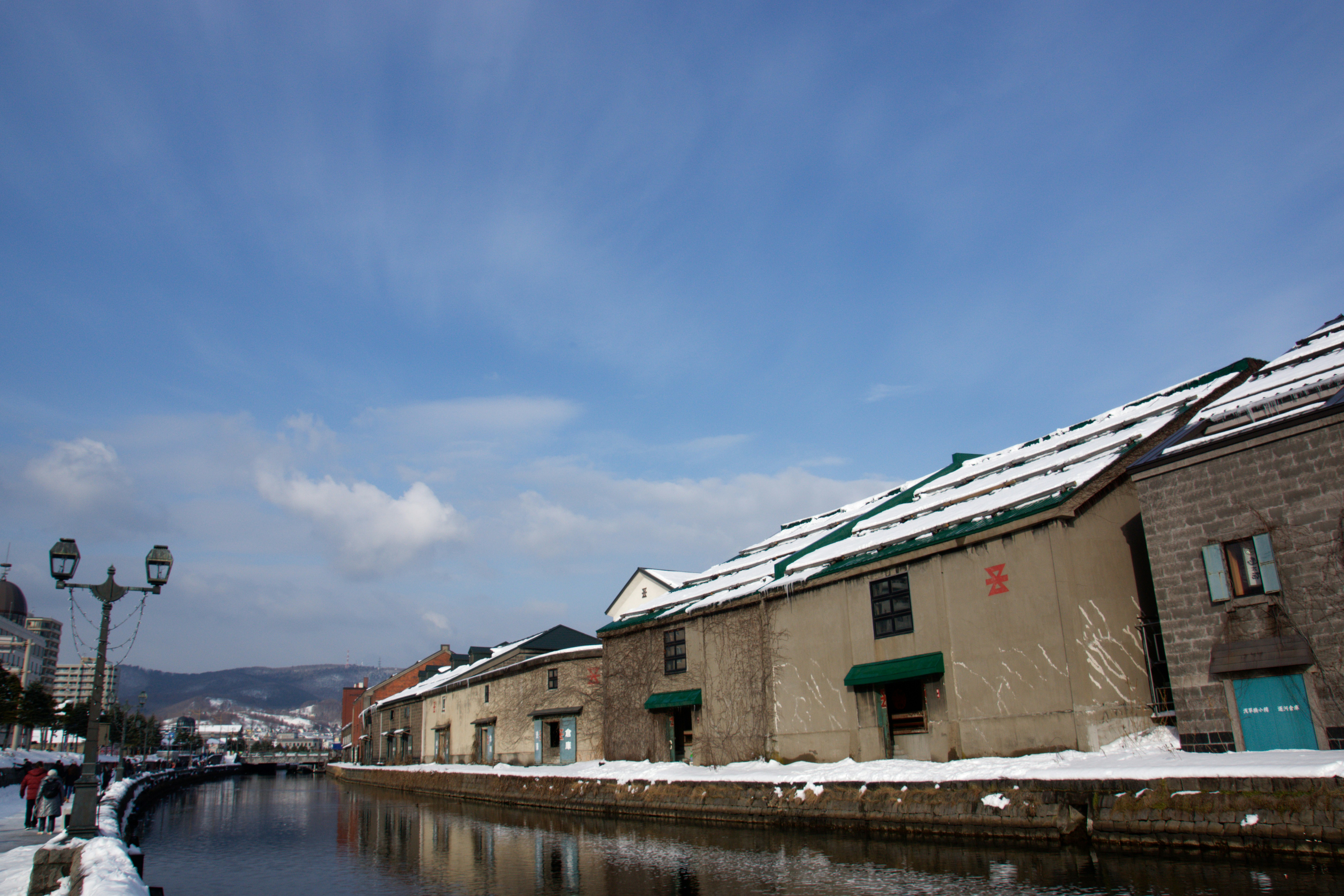 Historic buildings line a canal on a bright, clear day. photo – Free ...