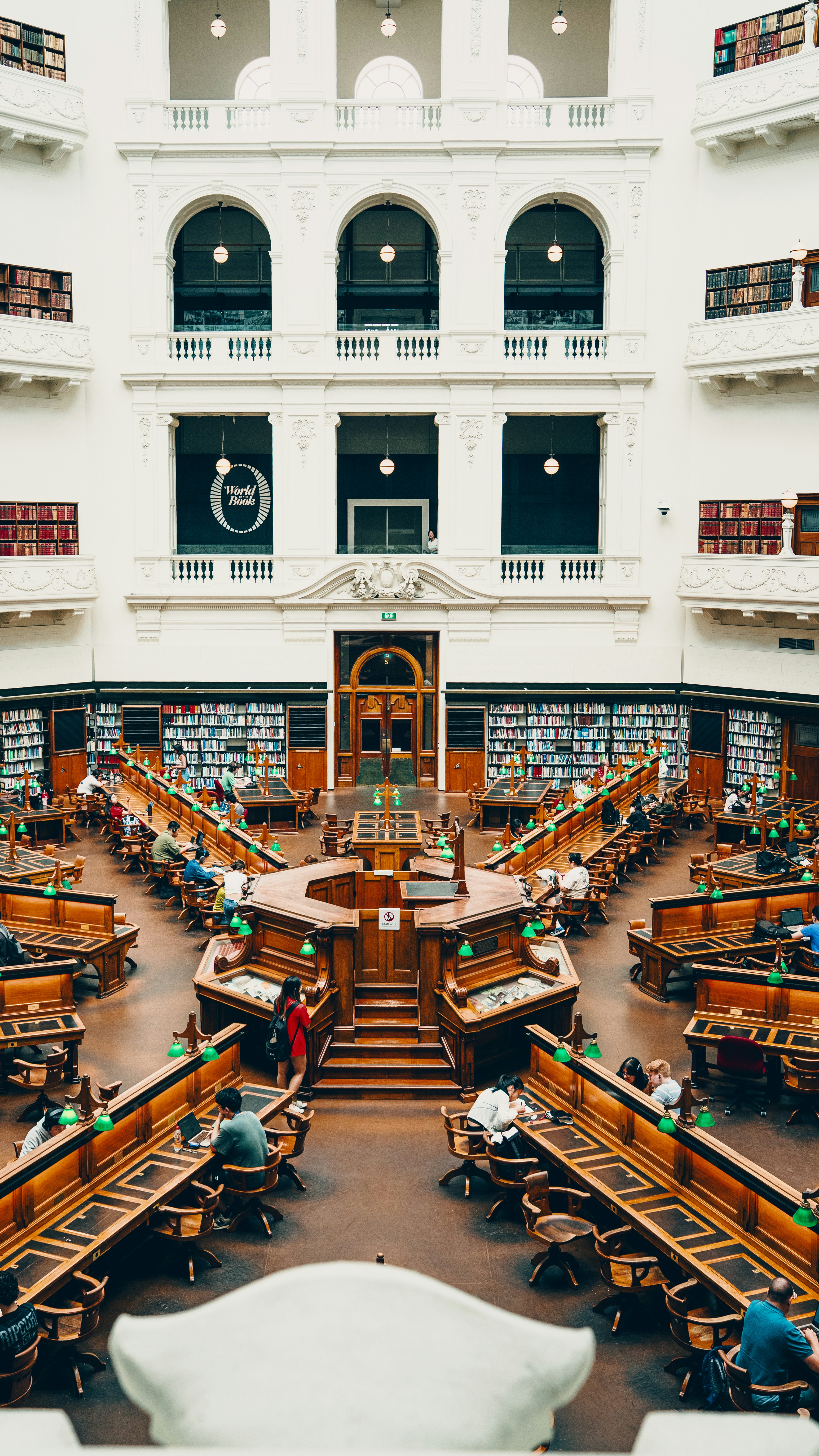A grand library with many people reading. photo – Free Iphone wallpaper ...