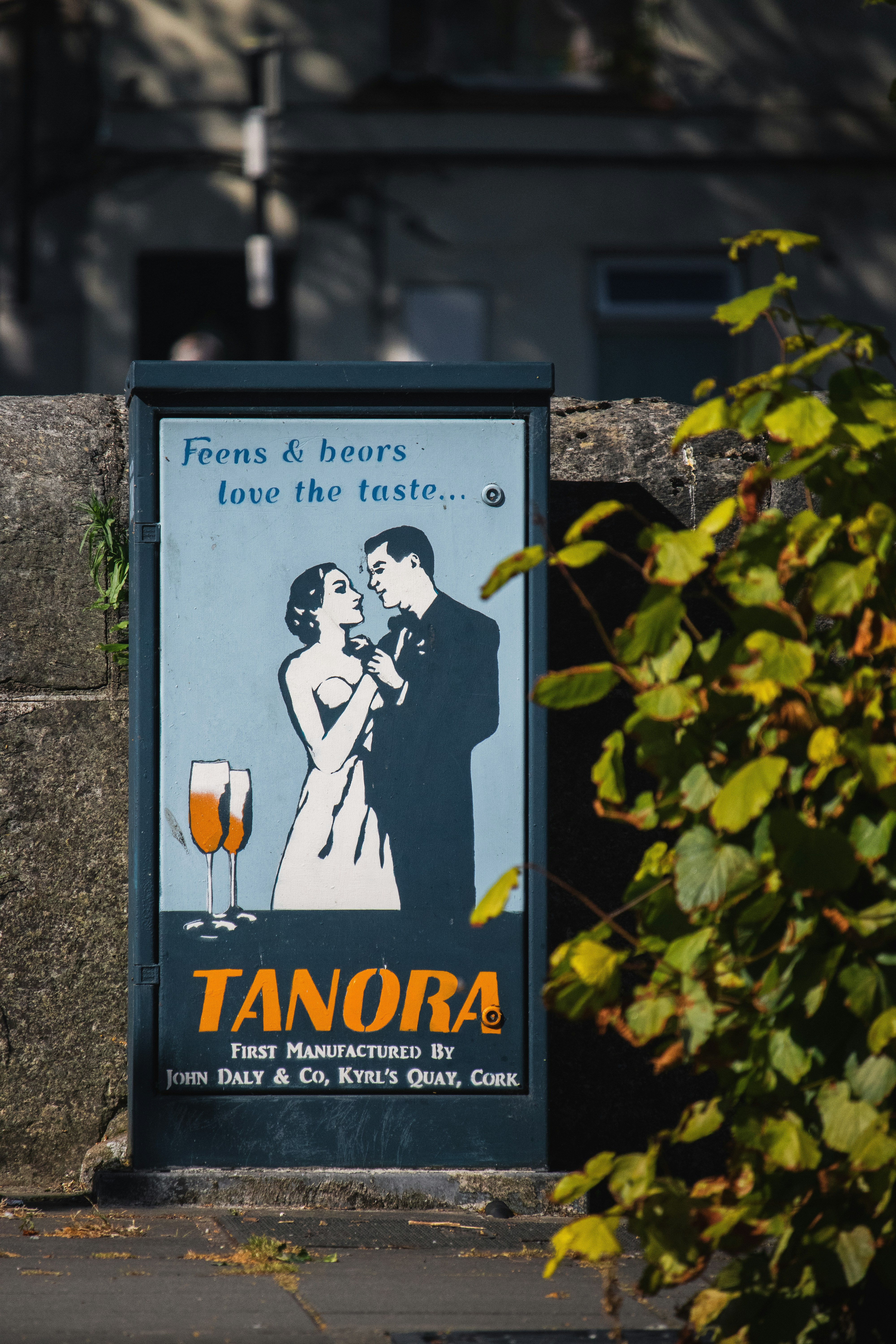 Poster Ad with Lovers in Conversation on a Street Wall