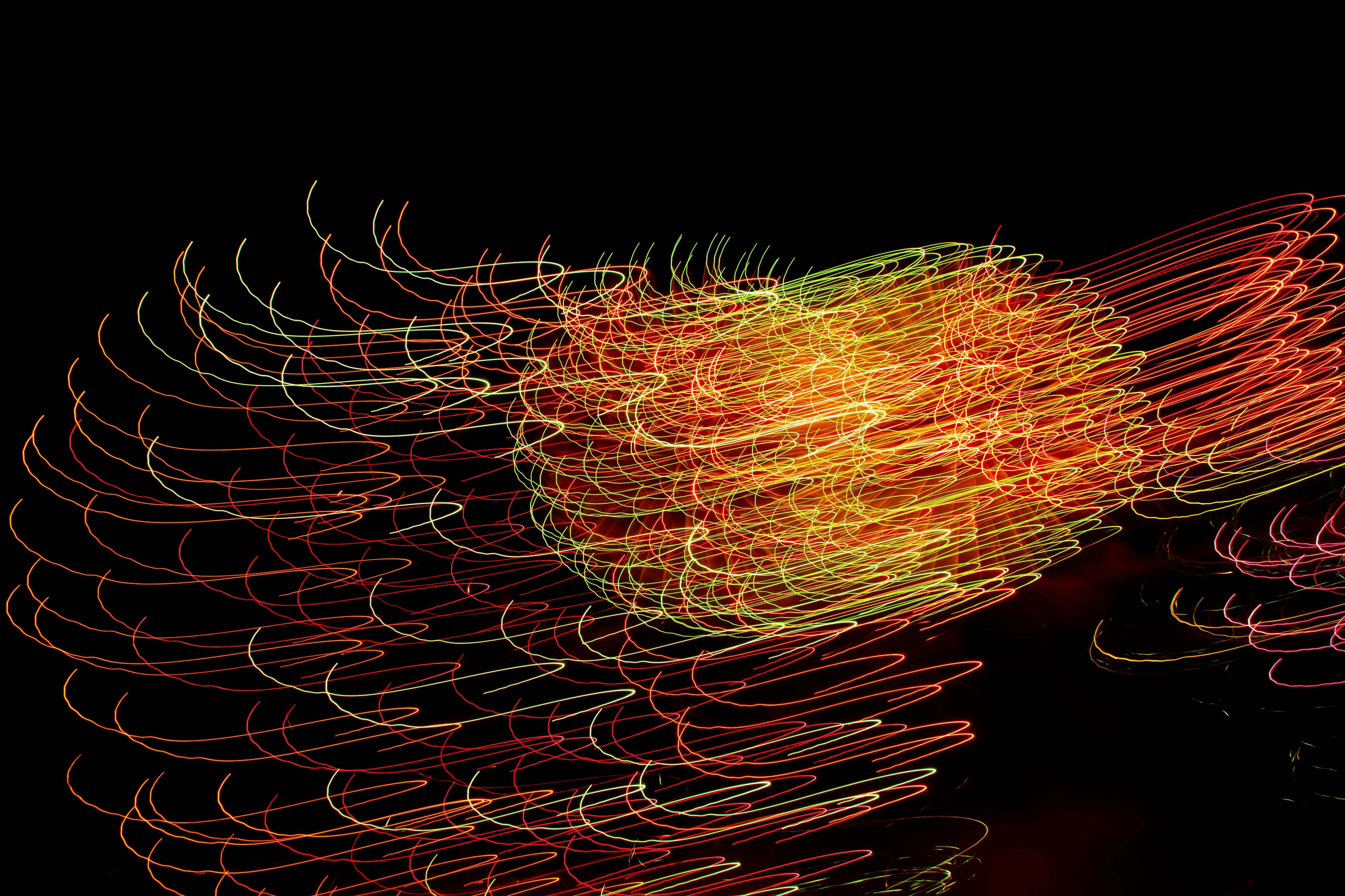 Spiral of Neon Arcs: Night-Exposure Light Painting