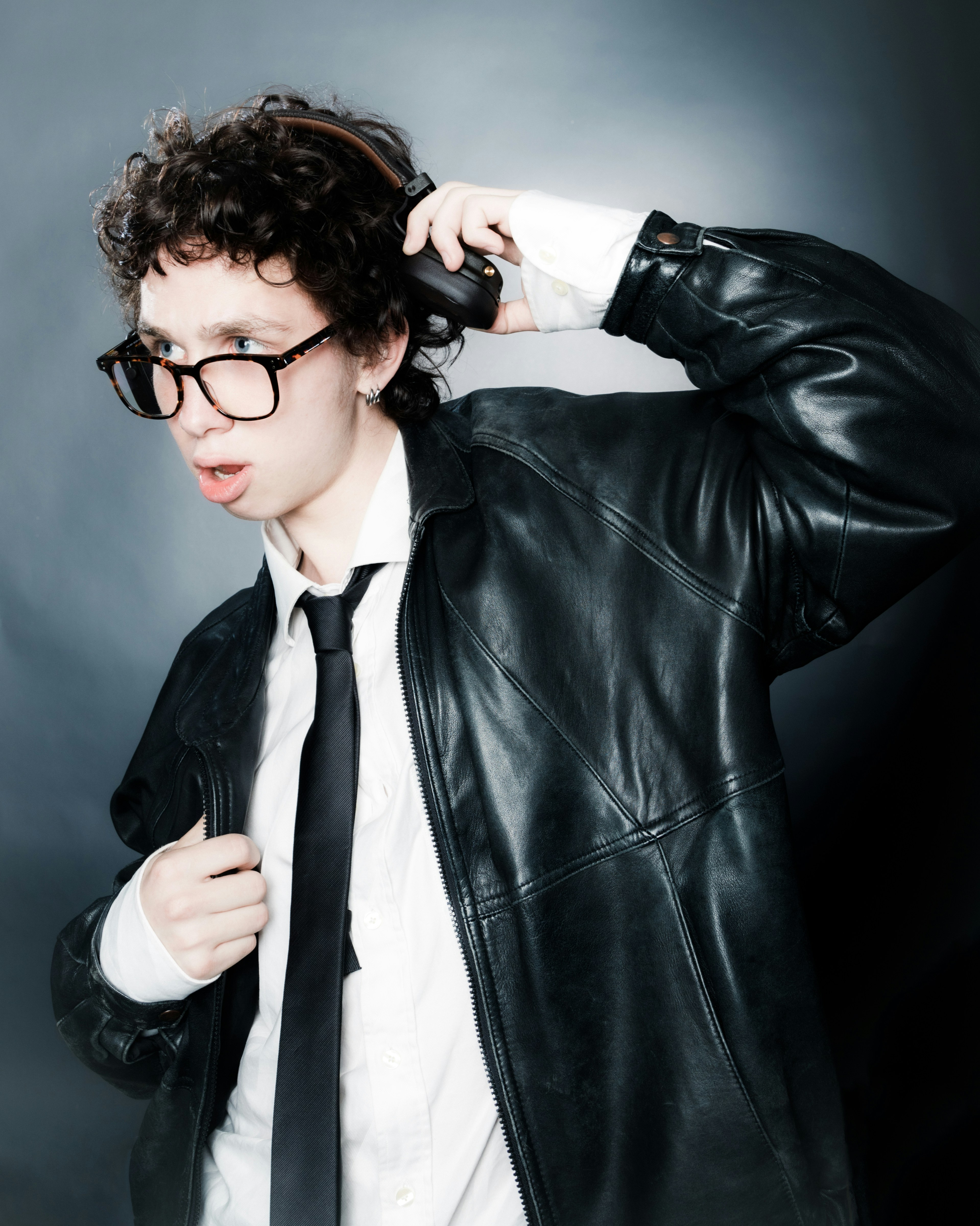 Retro Rebel in Leather: A Gritty Portrait with Headphones