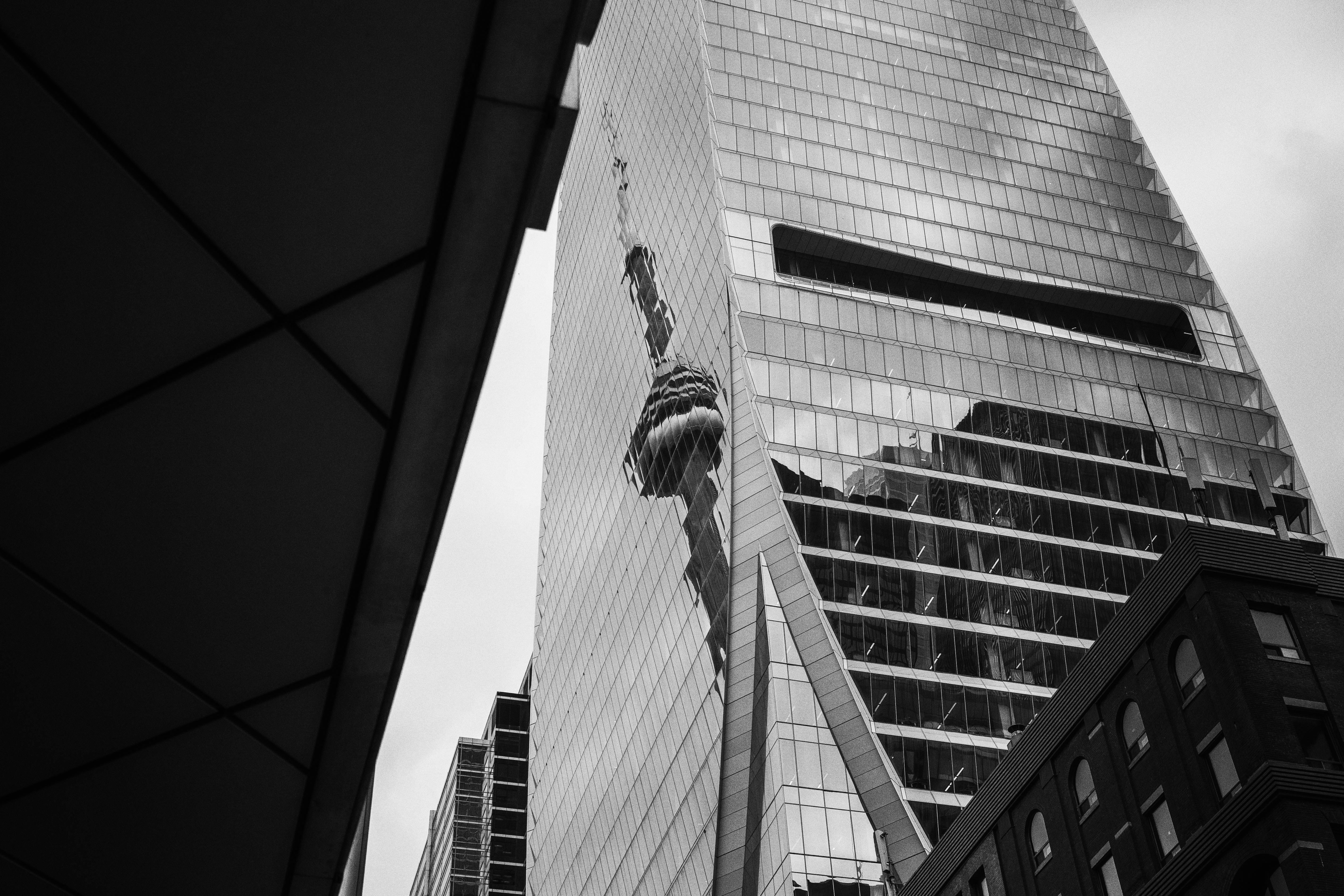 A skyscraper shows damage along its facade. photo – Free Building Image ...