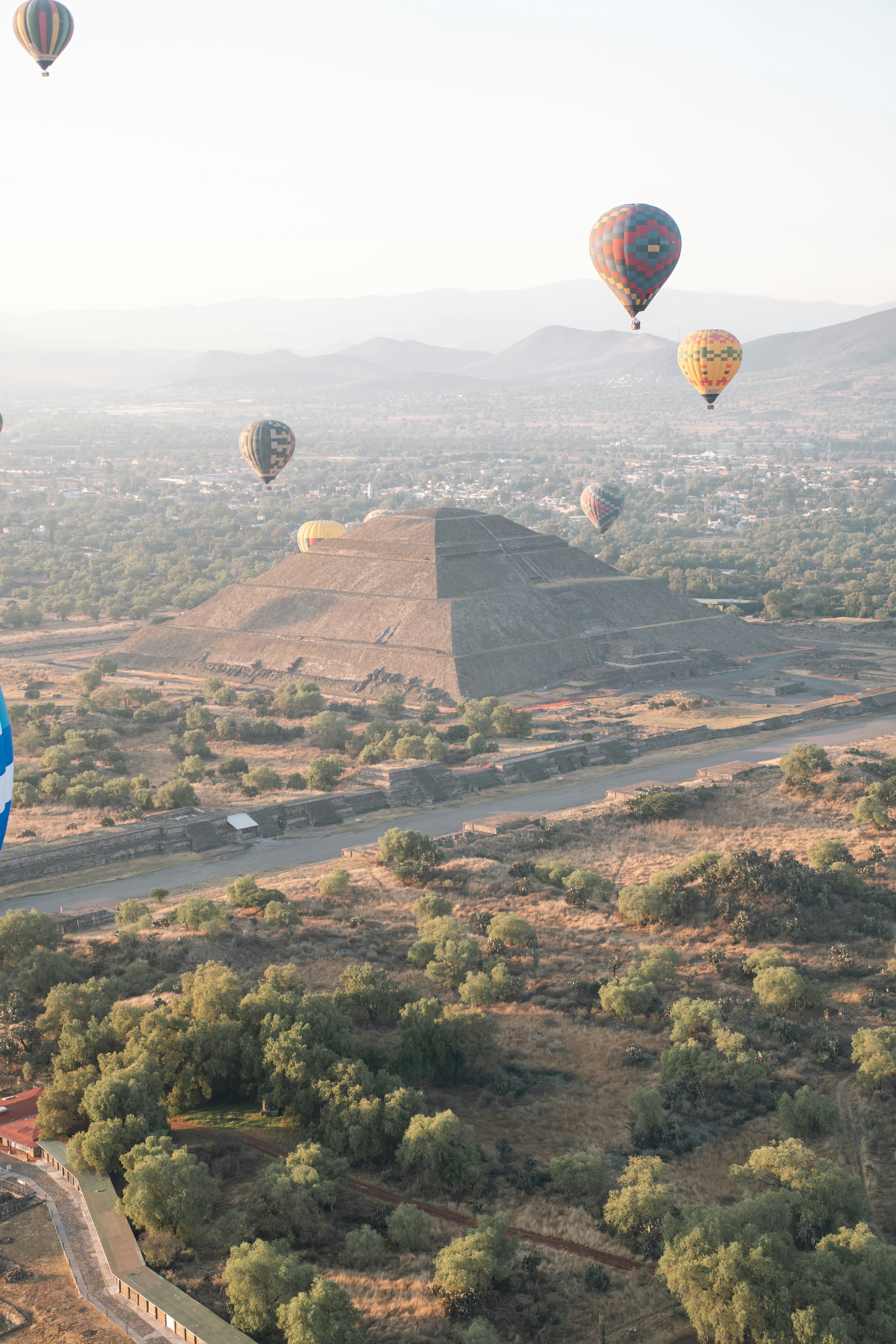 Hot air balloons float over the ancient pyramid. photo – Free Road ...