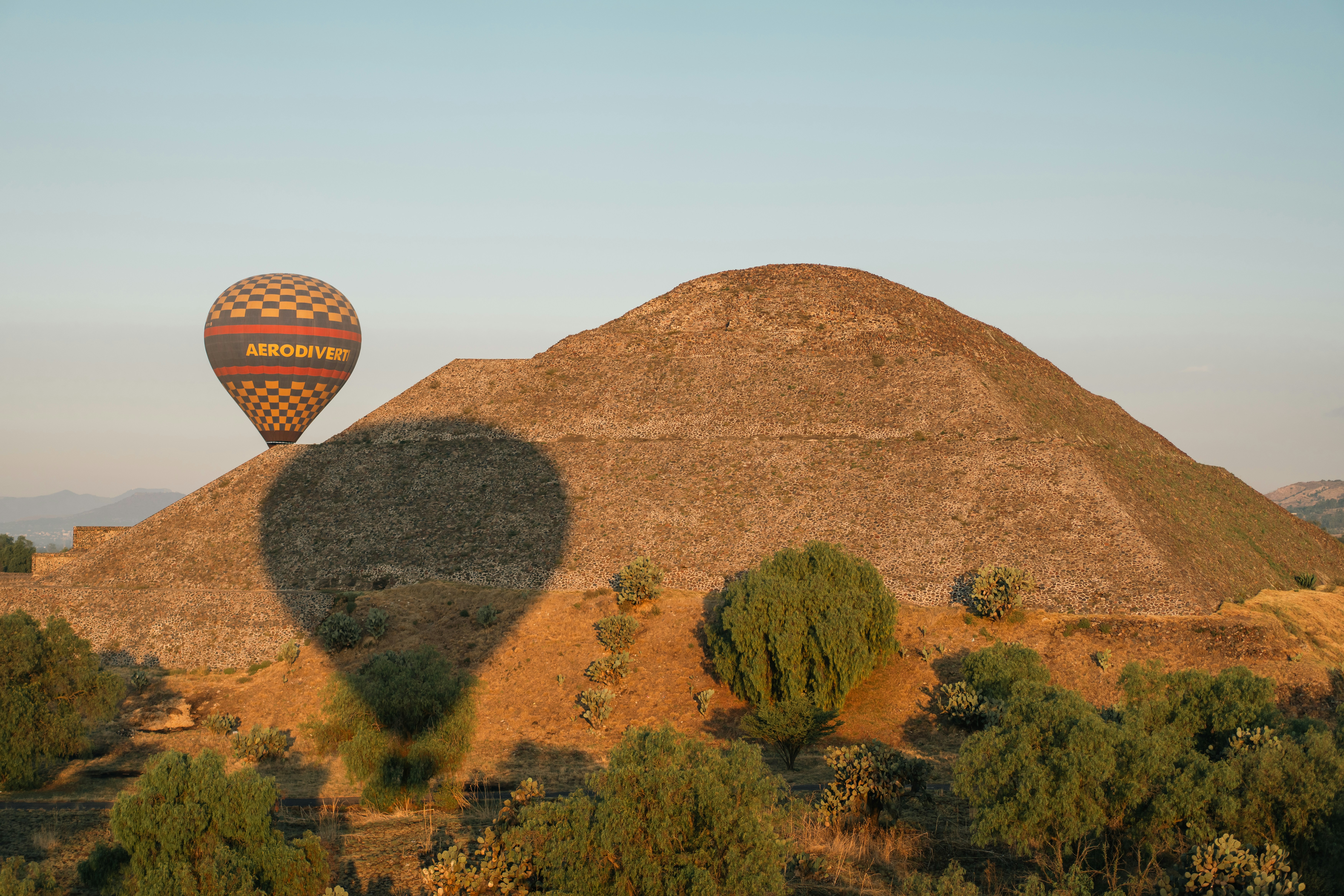 Balloon and Shadow Over the Ancient Hill