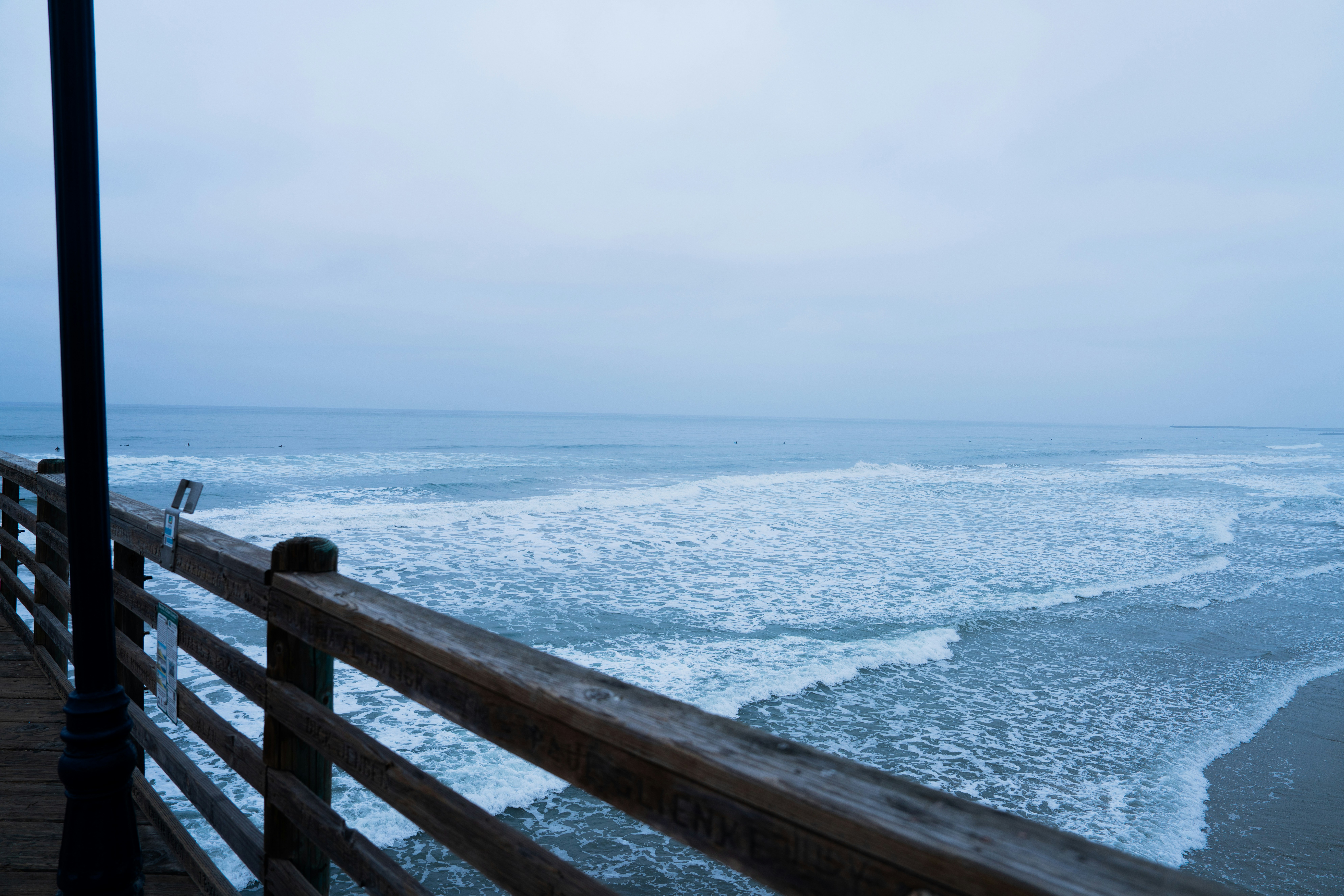 Seaside Rail: A Quiet Break Along the Weathered Pier