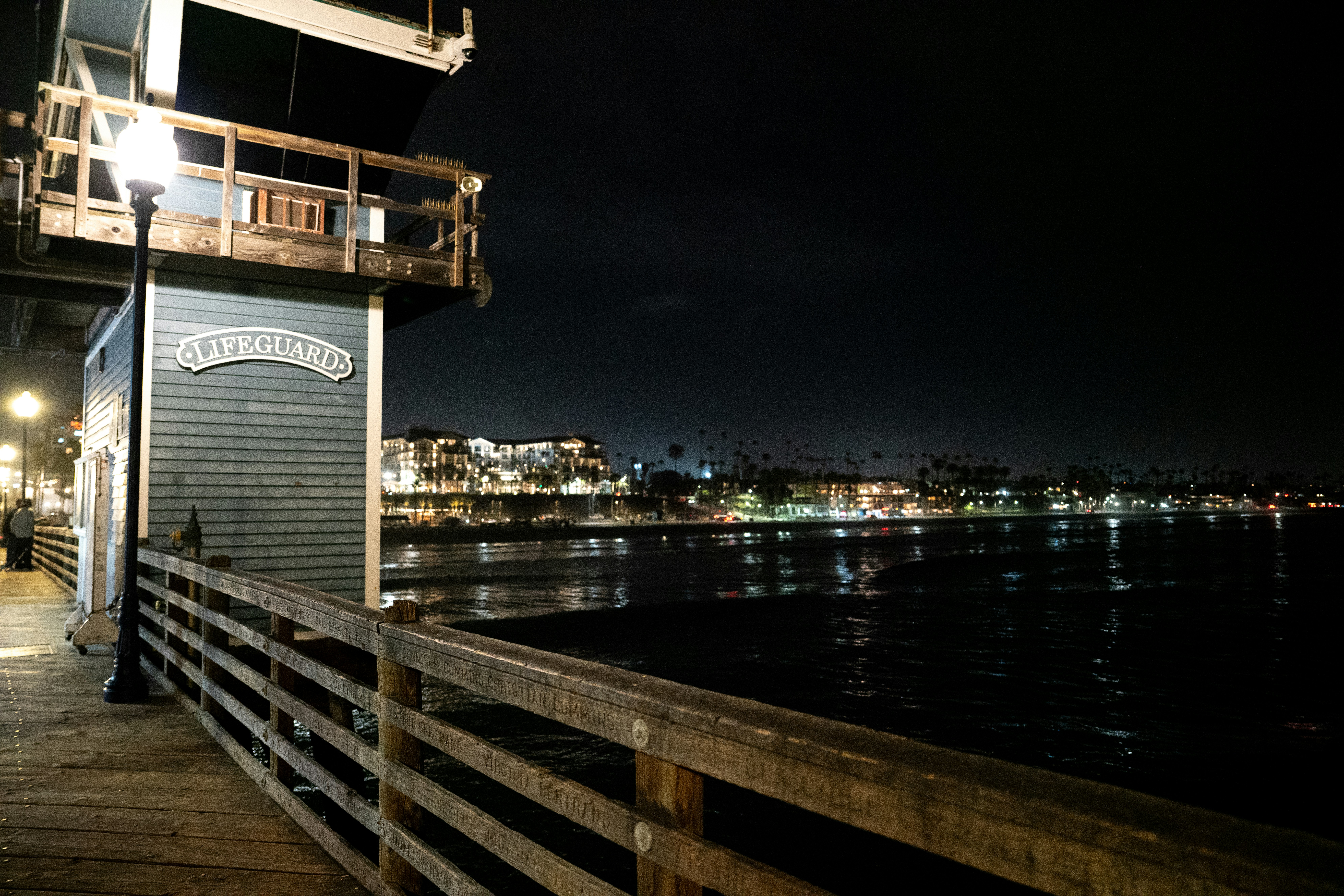 Nightwatch on the Pier: Lifeguard Tower Illuminates a Quiet Waterfront