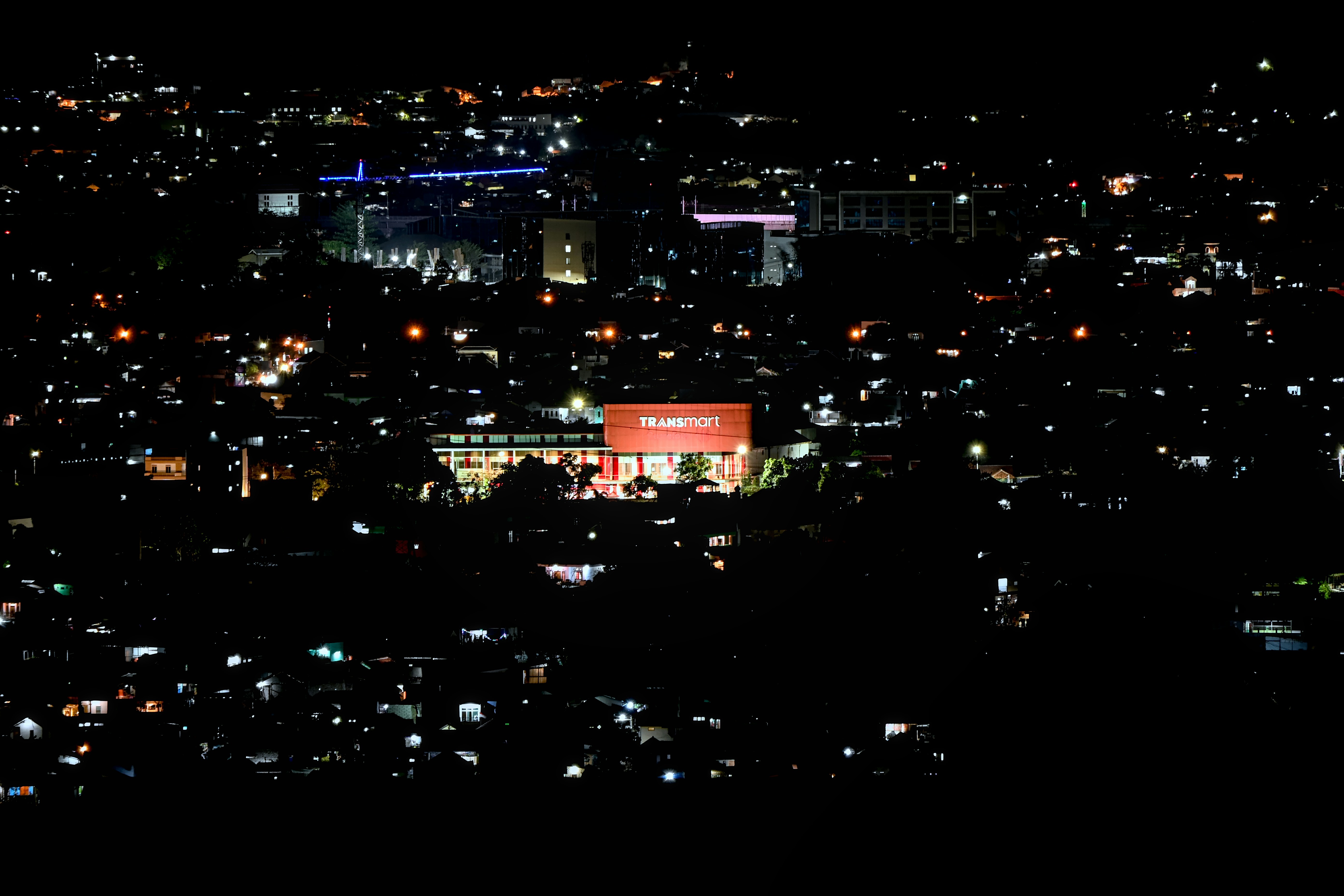 City lights illuminate the night sky. photo – Free Night city Image on ...