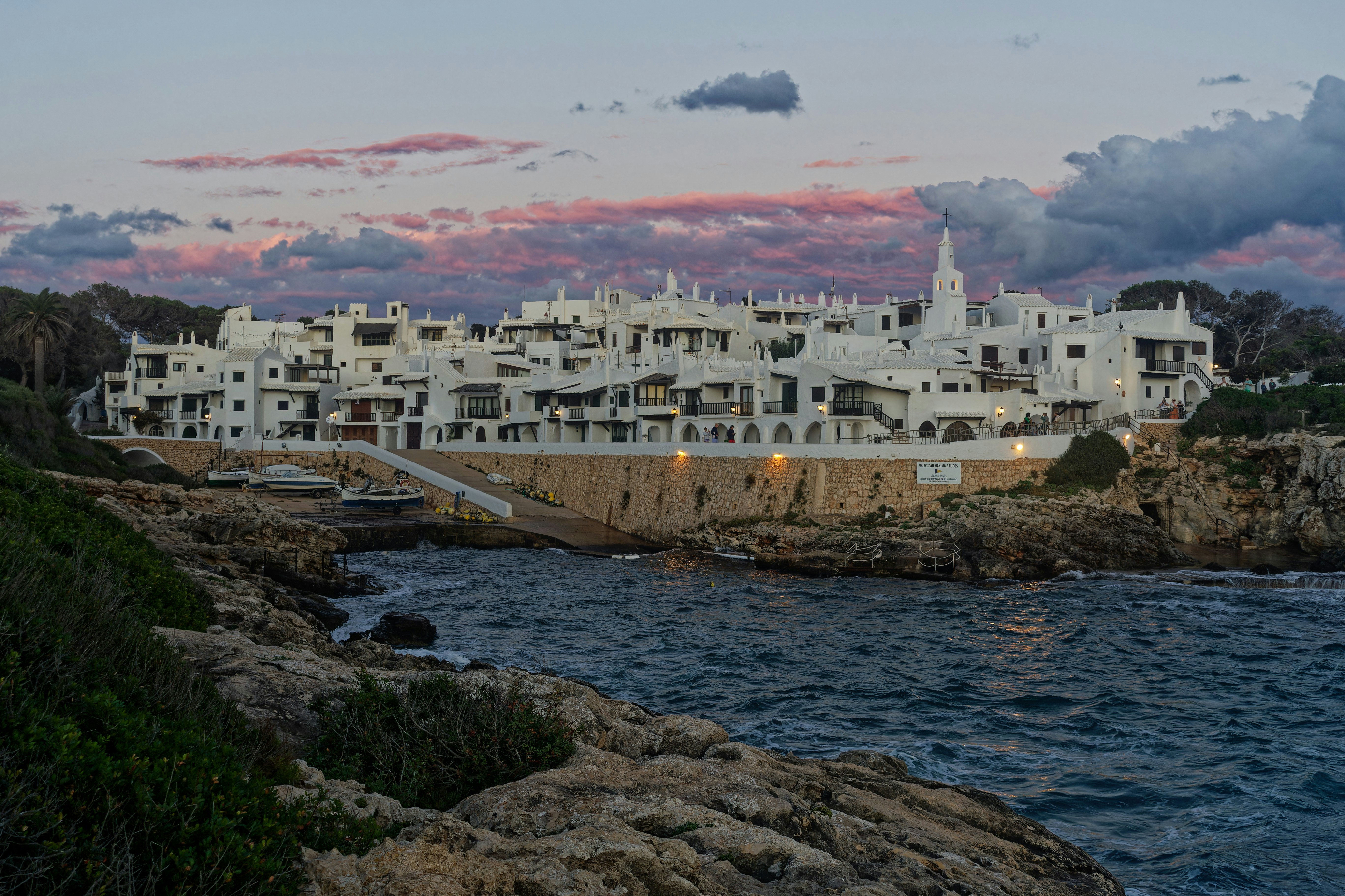 Rosy Twilight over a Cliffside White-Washed Village