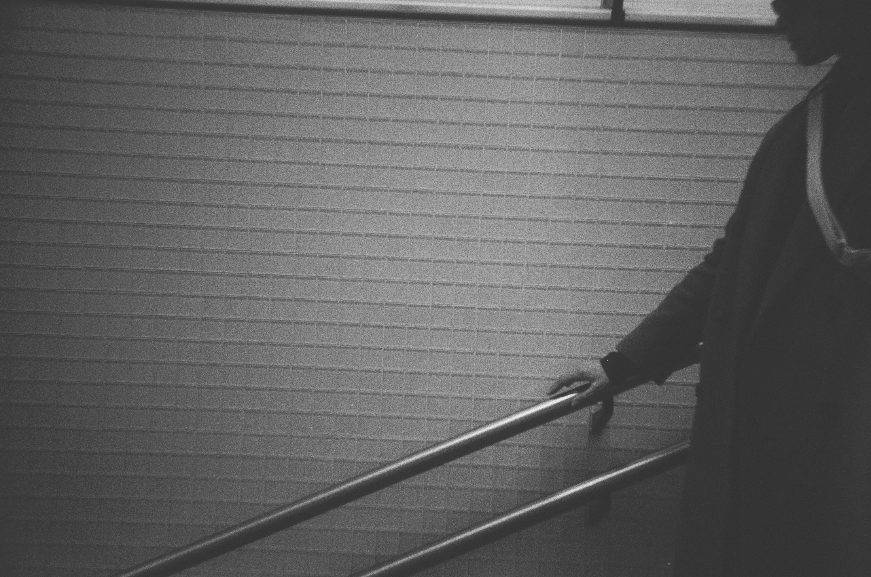 Person ascends stairs, holding onto the railing. photo – Free City ...