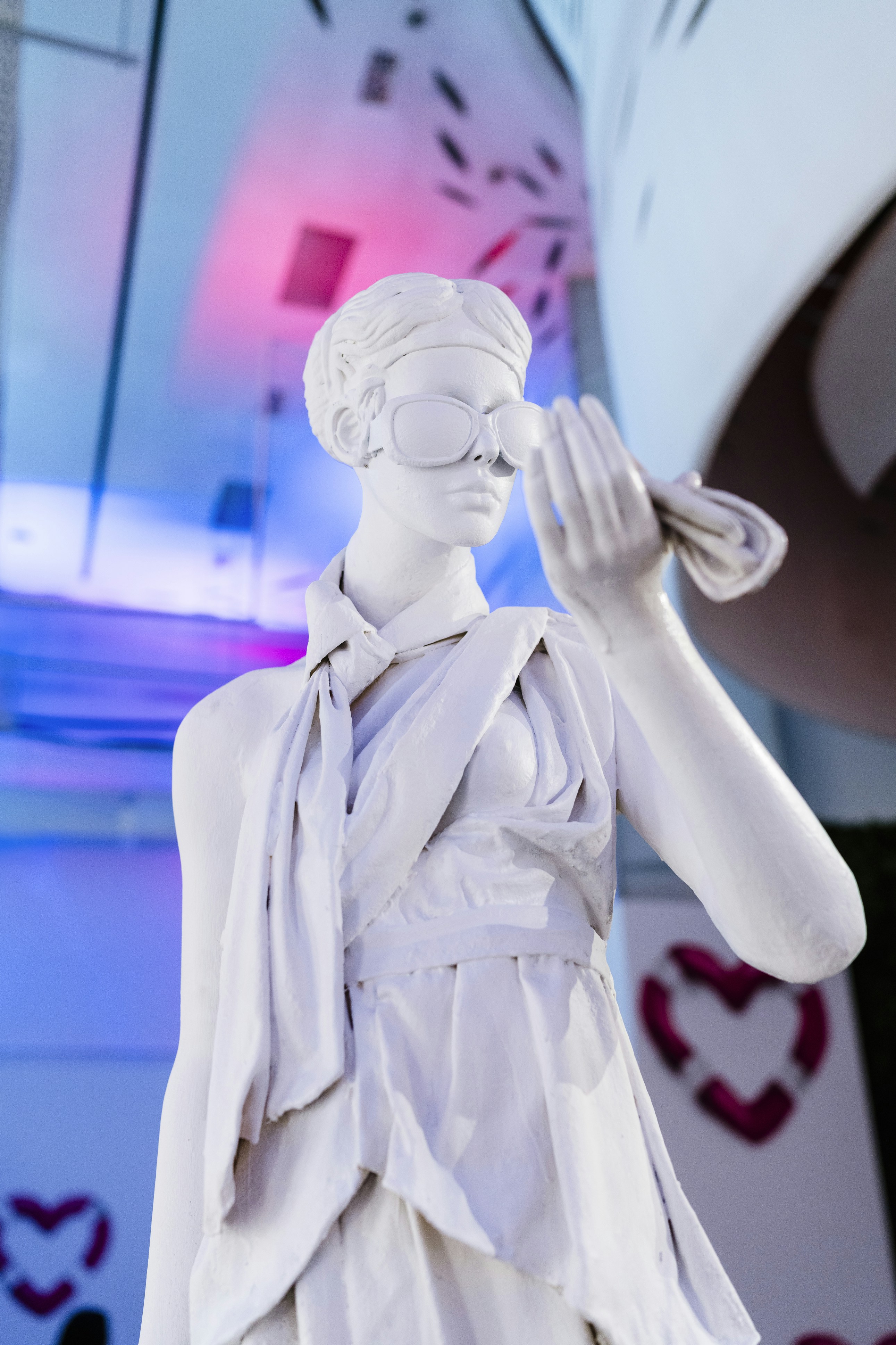 Ice Sculptor in Focus: A Suspended Silhouette in Neon Light