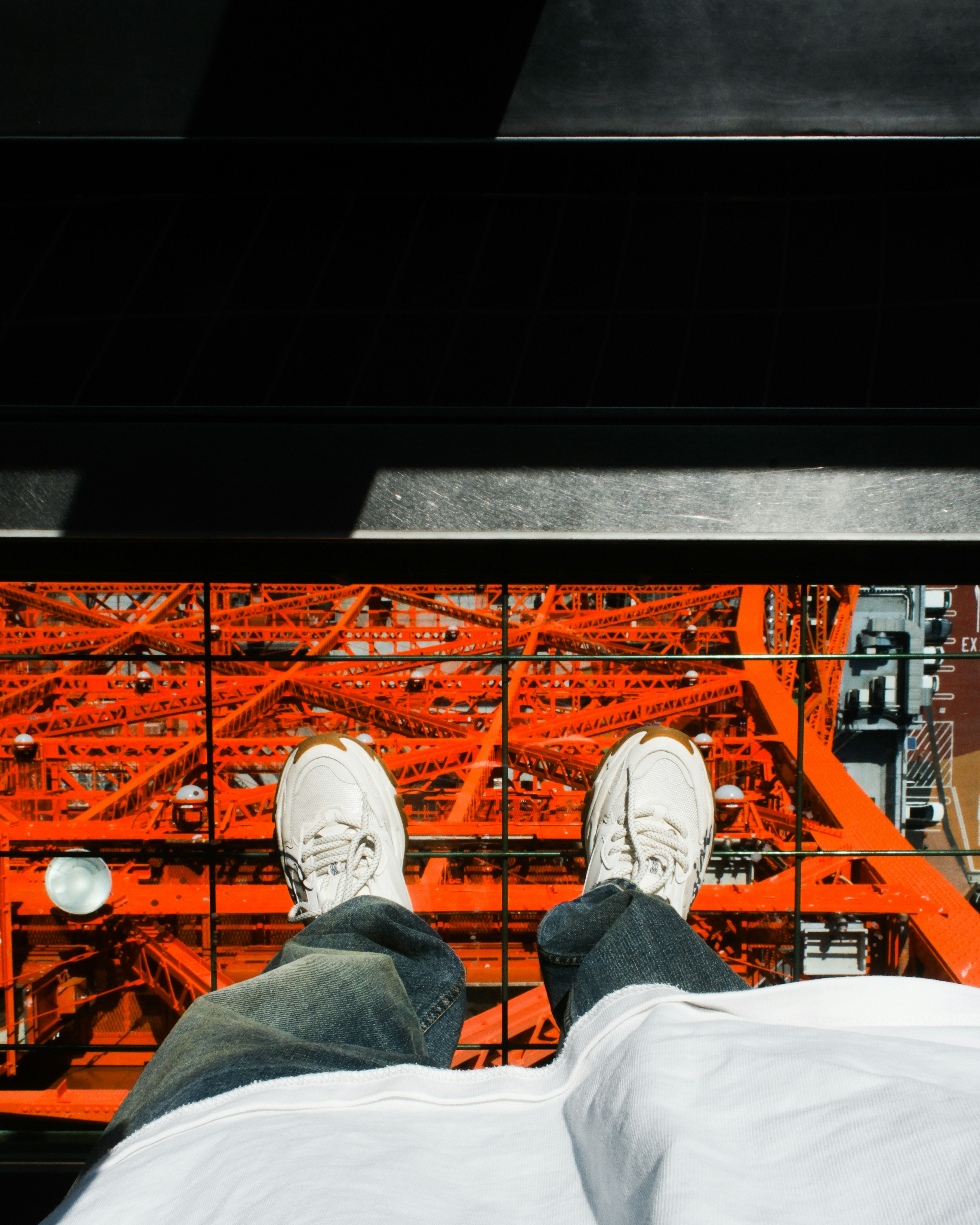 Glass-Floor Gaze: Feet Above the Red Lattice