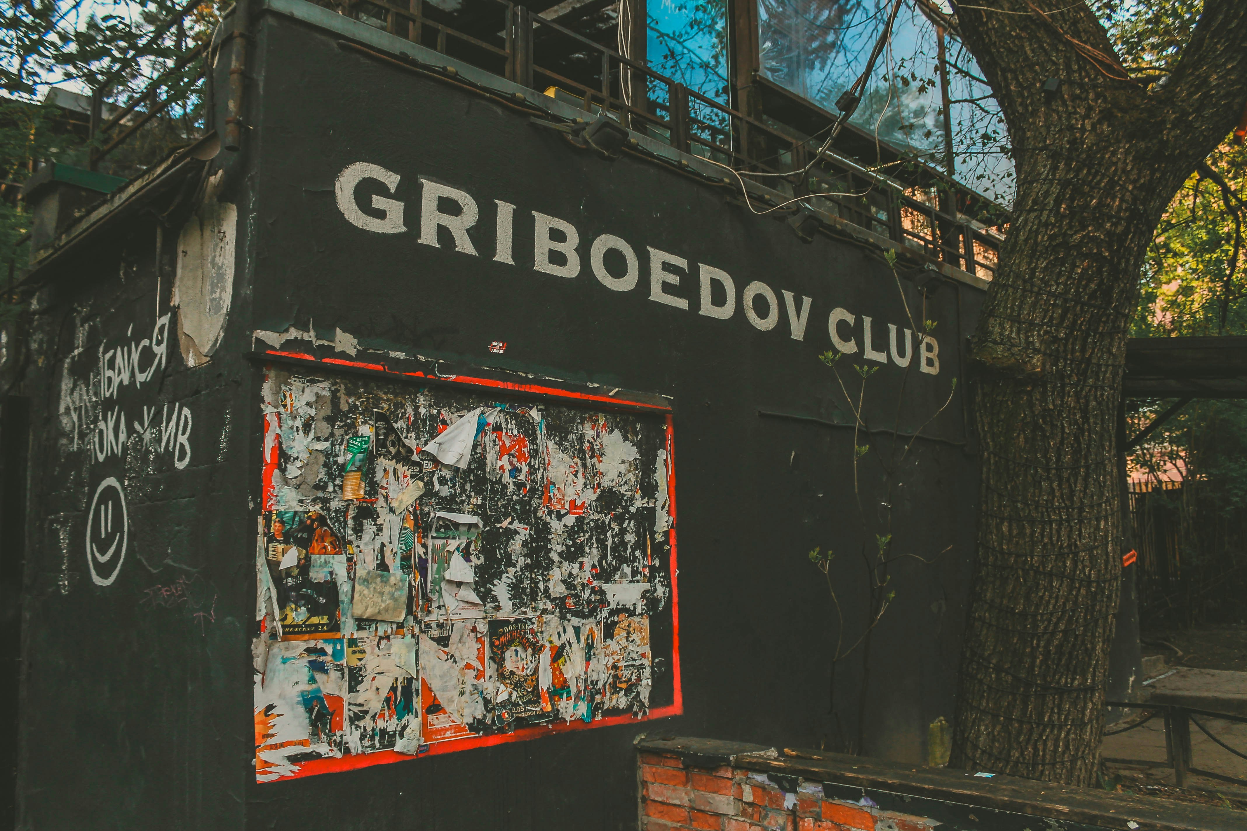 The griboedov club sign is seen on a building. photo – Free Building ...