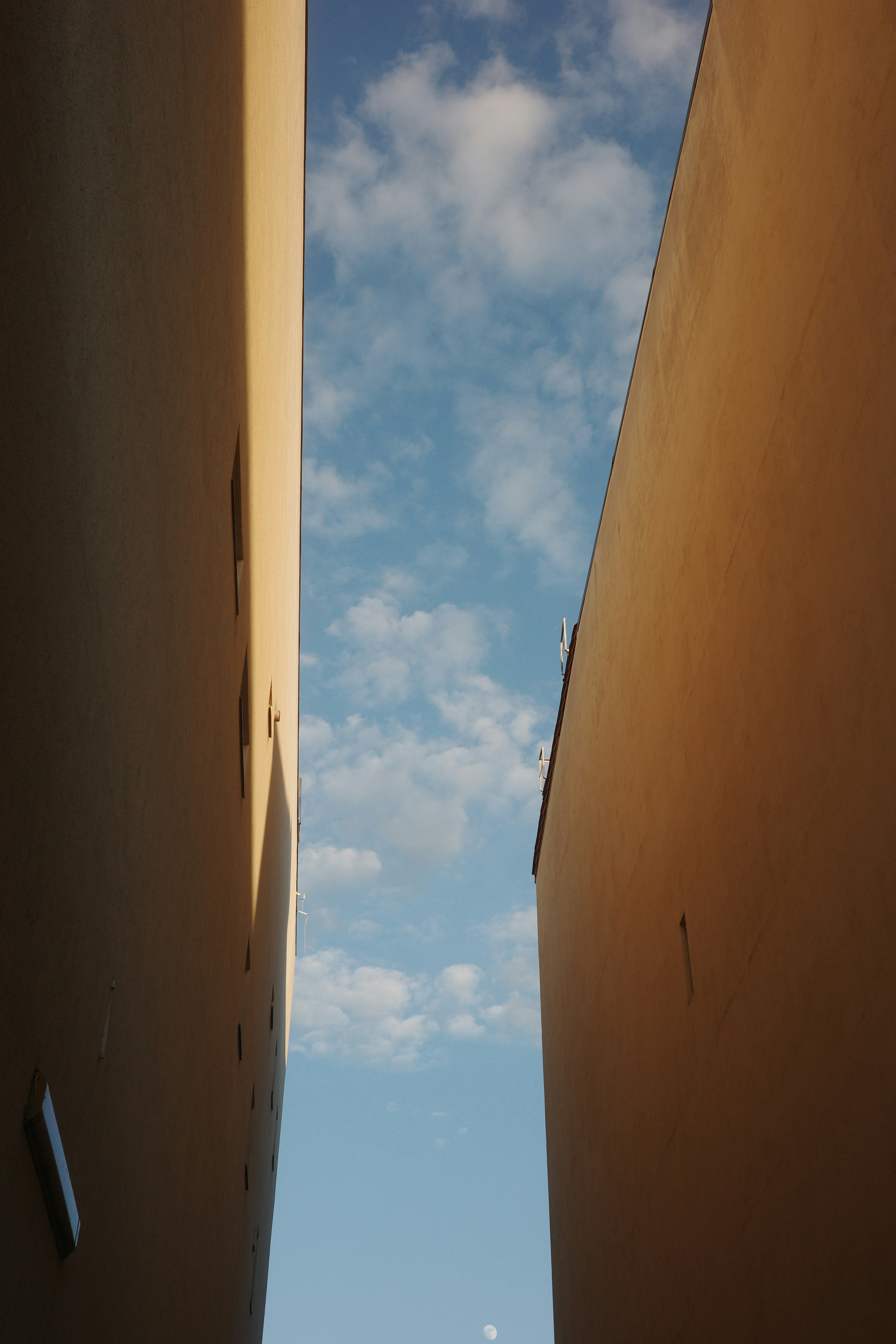 Buildings frame the sky in this upward shot.