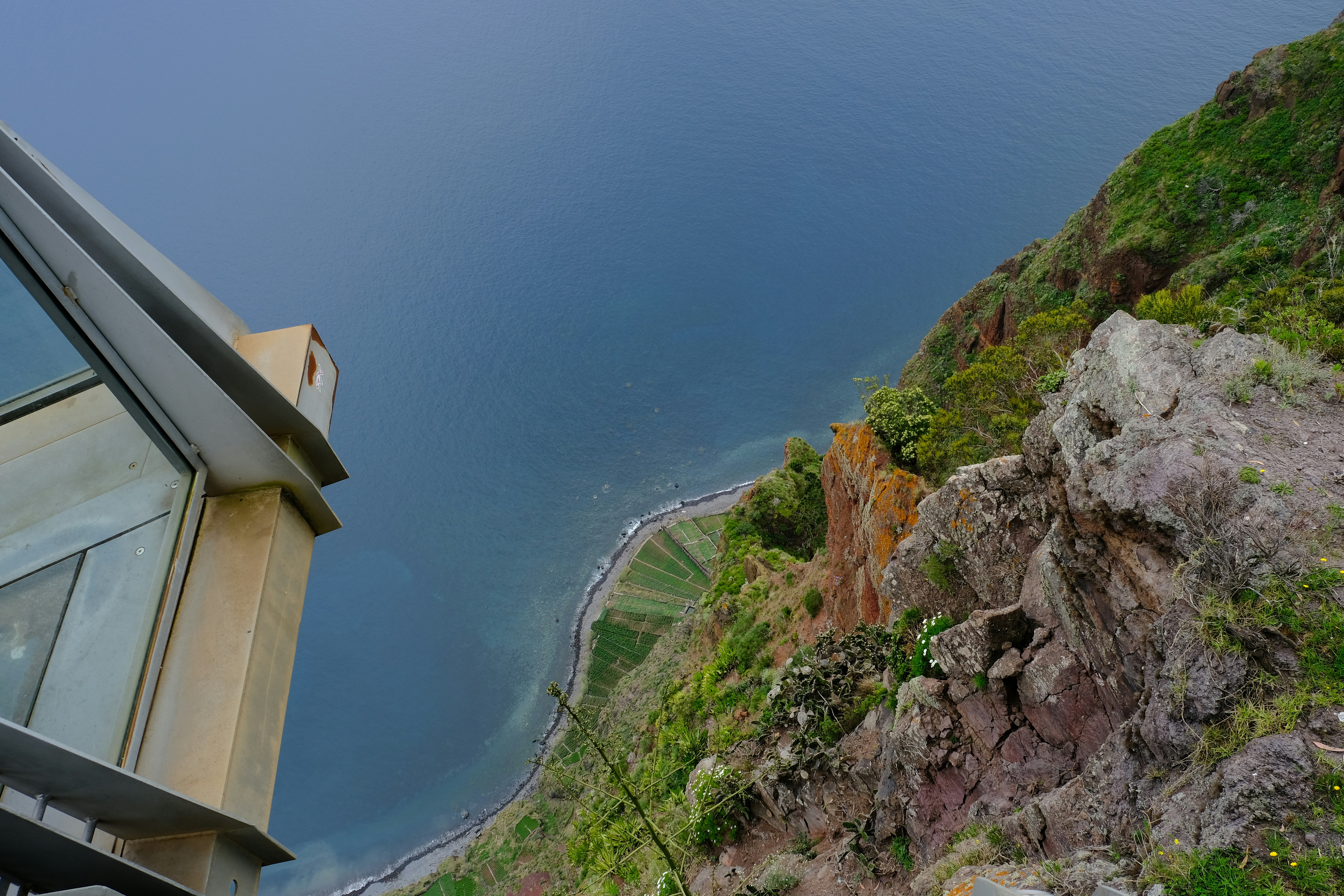 Edge Balcony: A Cliffside Vista Over Sea and Stone