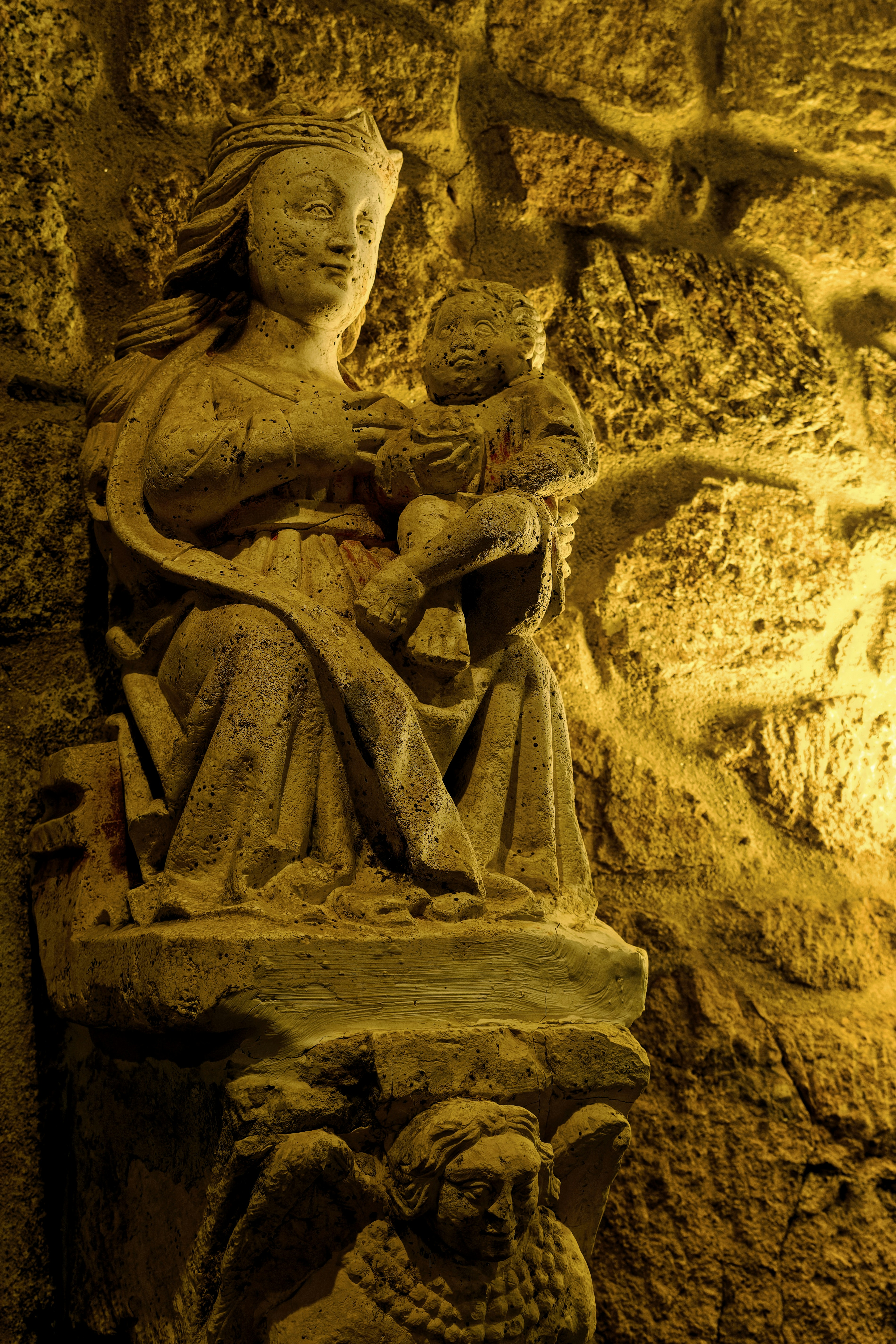 Amber Quietude: Madonna and Child in a Stone Niche