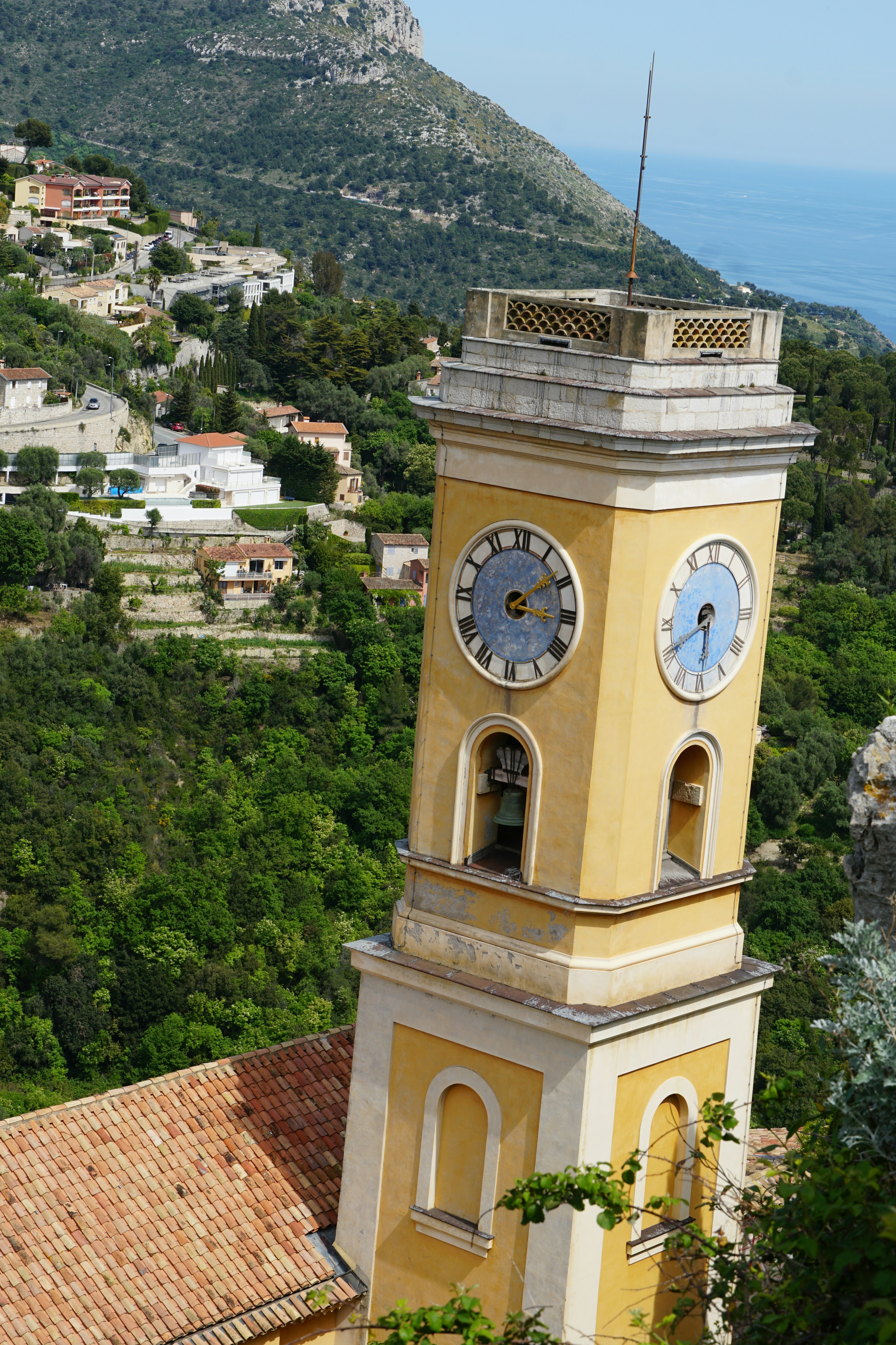 Clock Tower Rising Over a Coastal Village