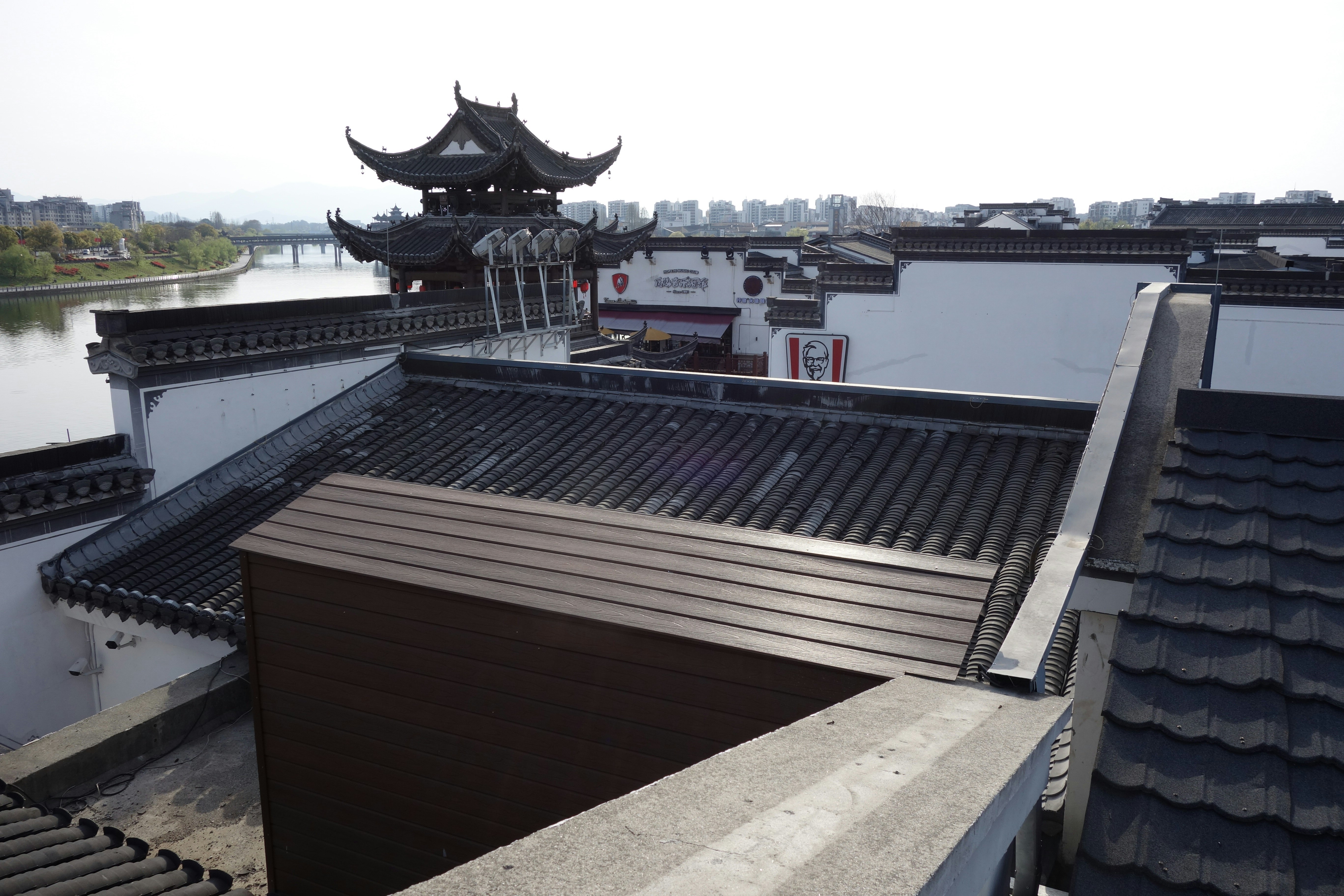 Pagoda Silhouette Over White-Walled Alleys by a Quiet Jiangnan Canal