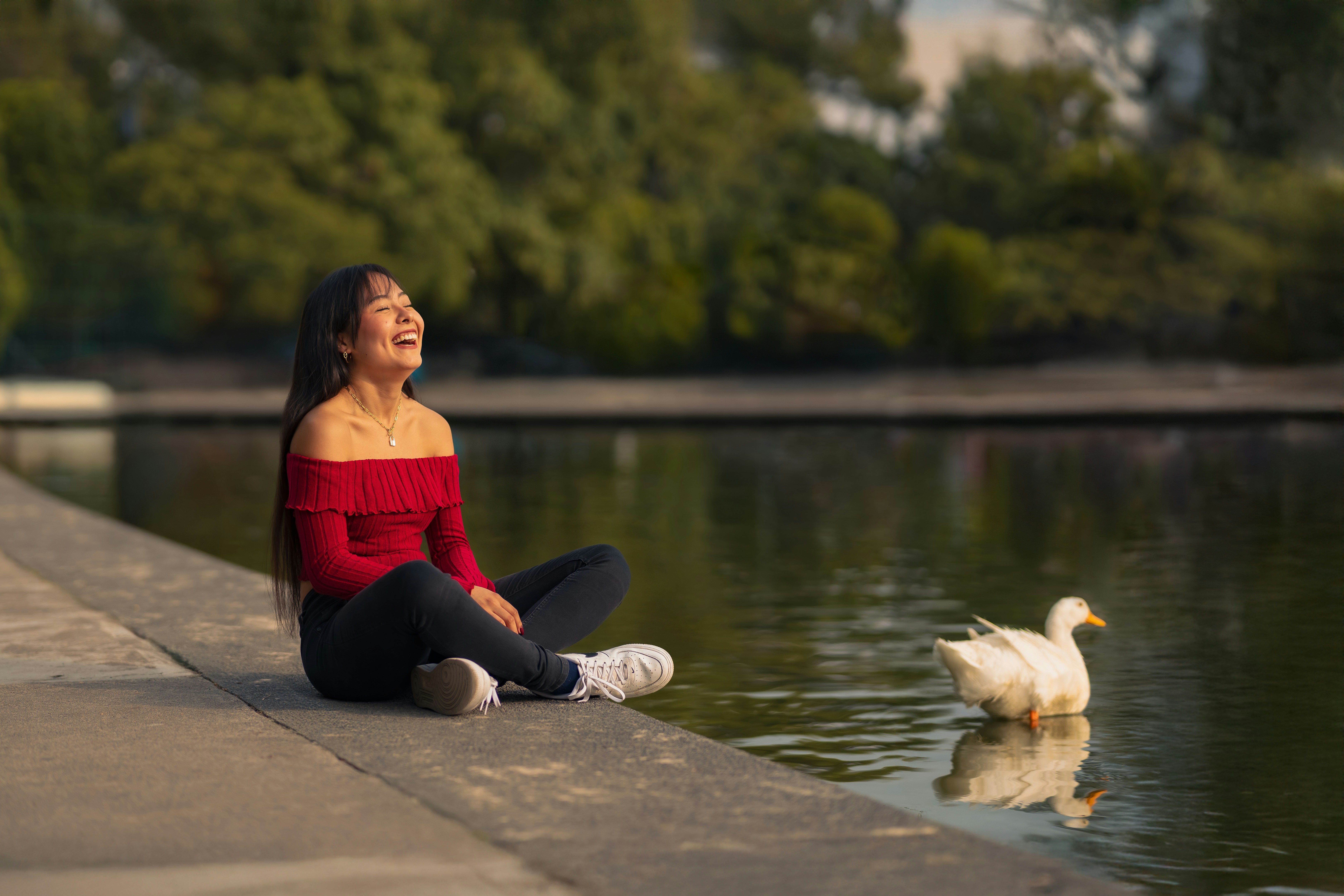 Sunlit Smile by the Water: A Quiet Portrait by the Pond