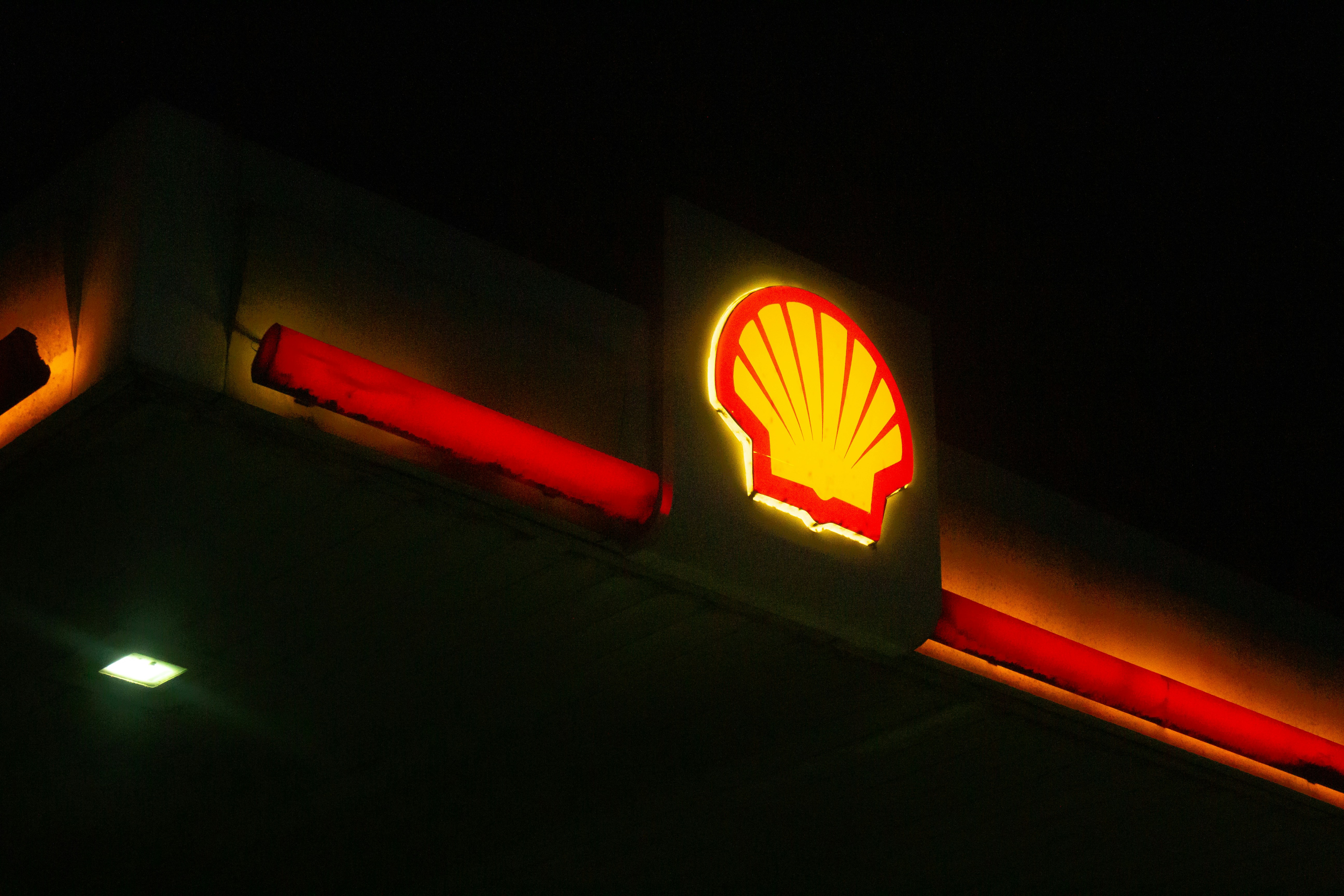 Shell gas station sign illuminated at night. photo – Free Night Image ...