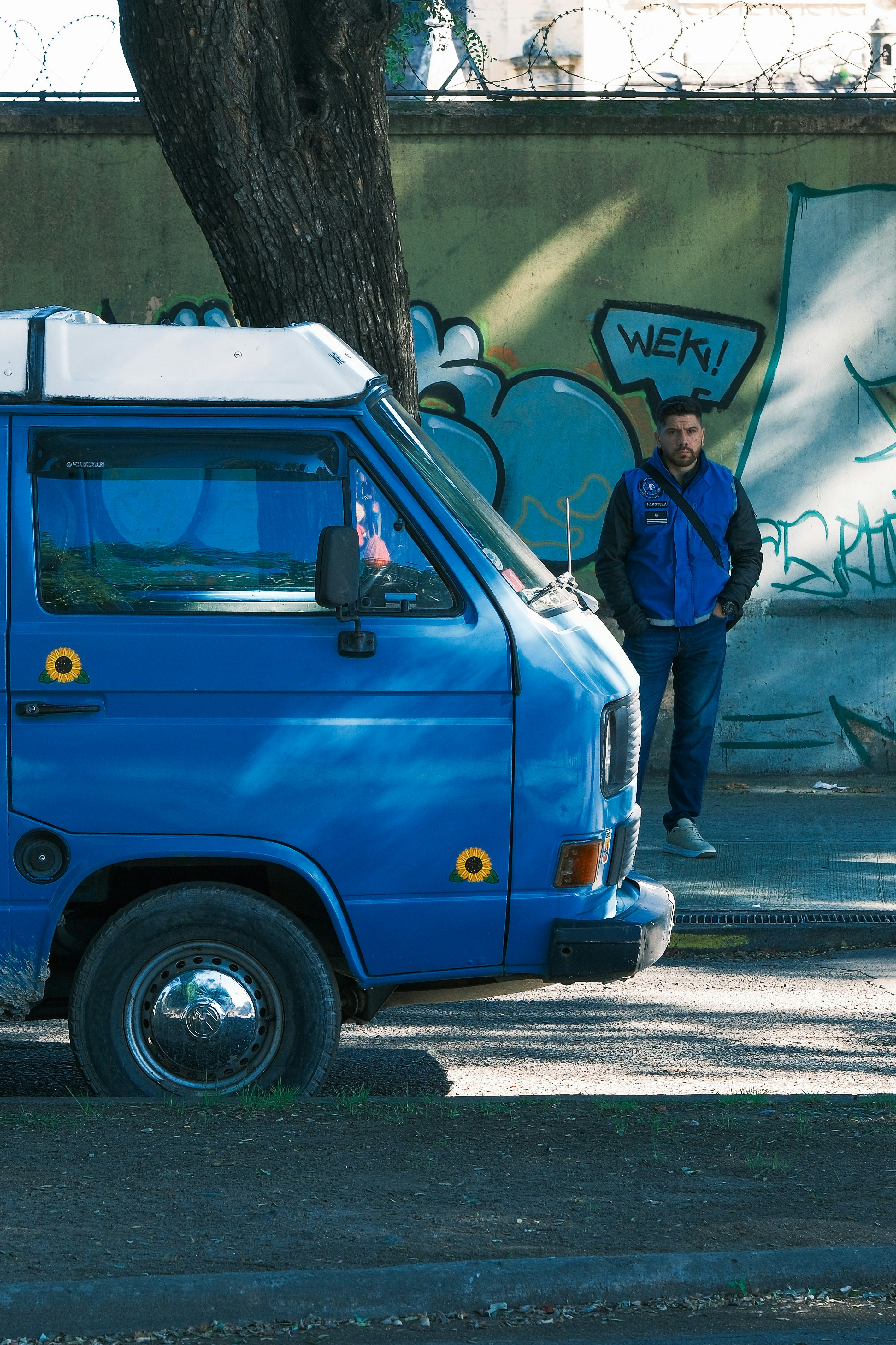 Cobalt Corridor: A Street Moment by the Graffiti Wall