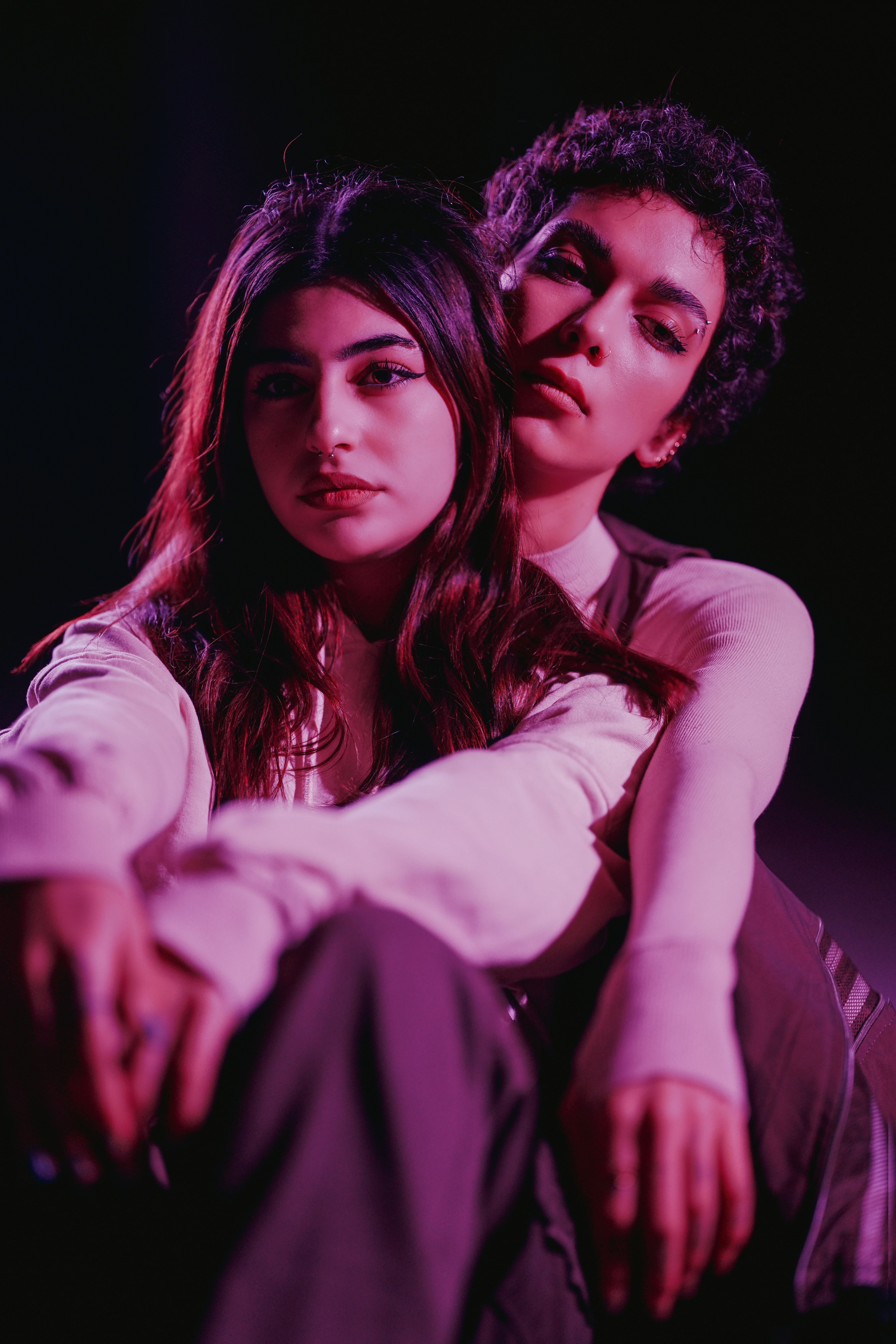 Two young people are embracing under violet light. photo – Free Woman ...
