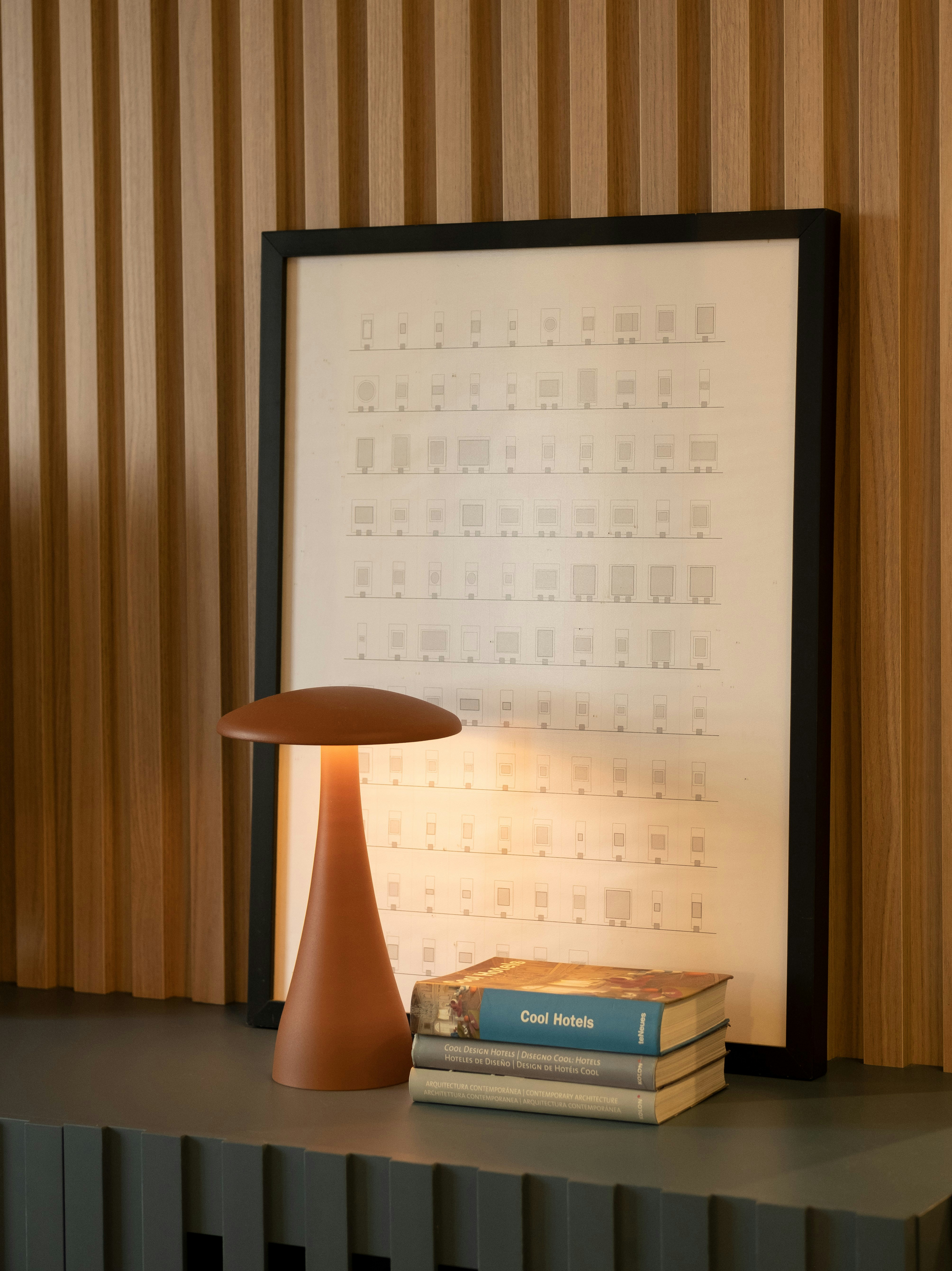 A lamp and books sit by a framed print. photo – Free Texture Image on ...