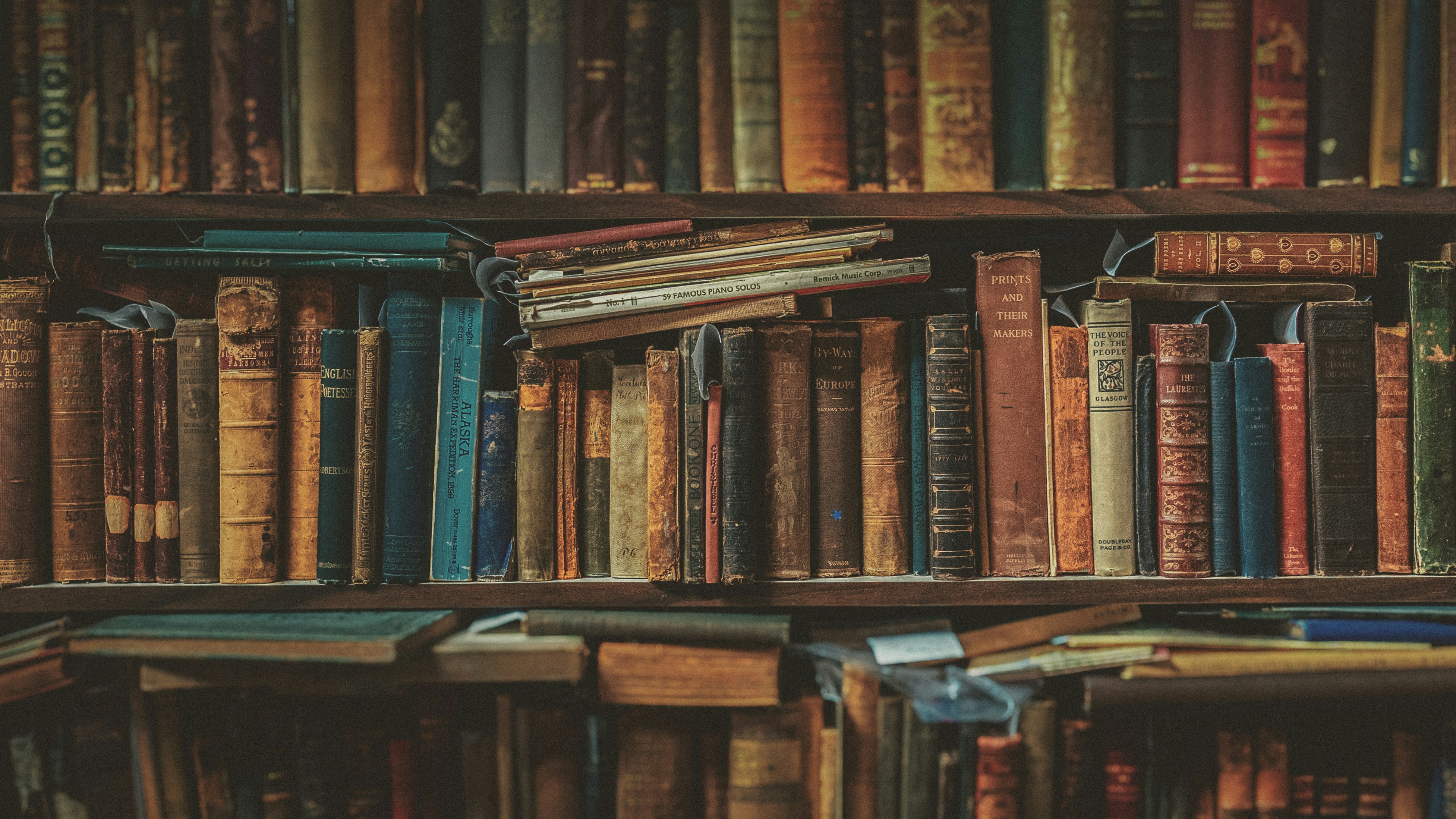 Books neatly stacked on a wooden bookshelf. photo – Free Books Image on ...