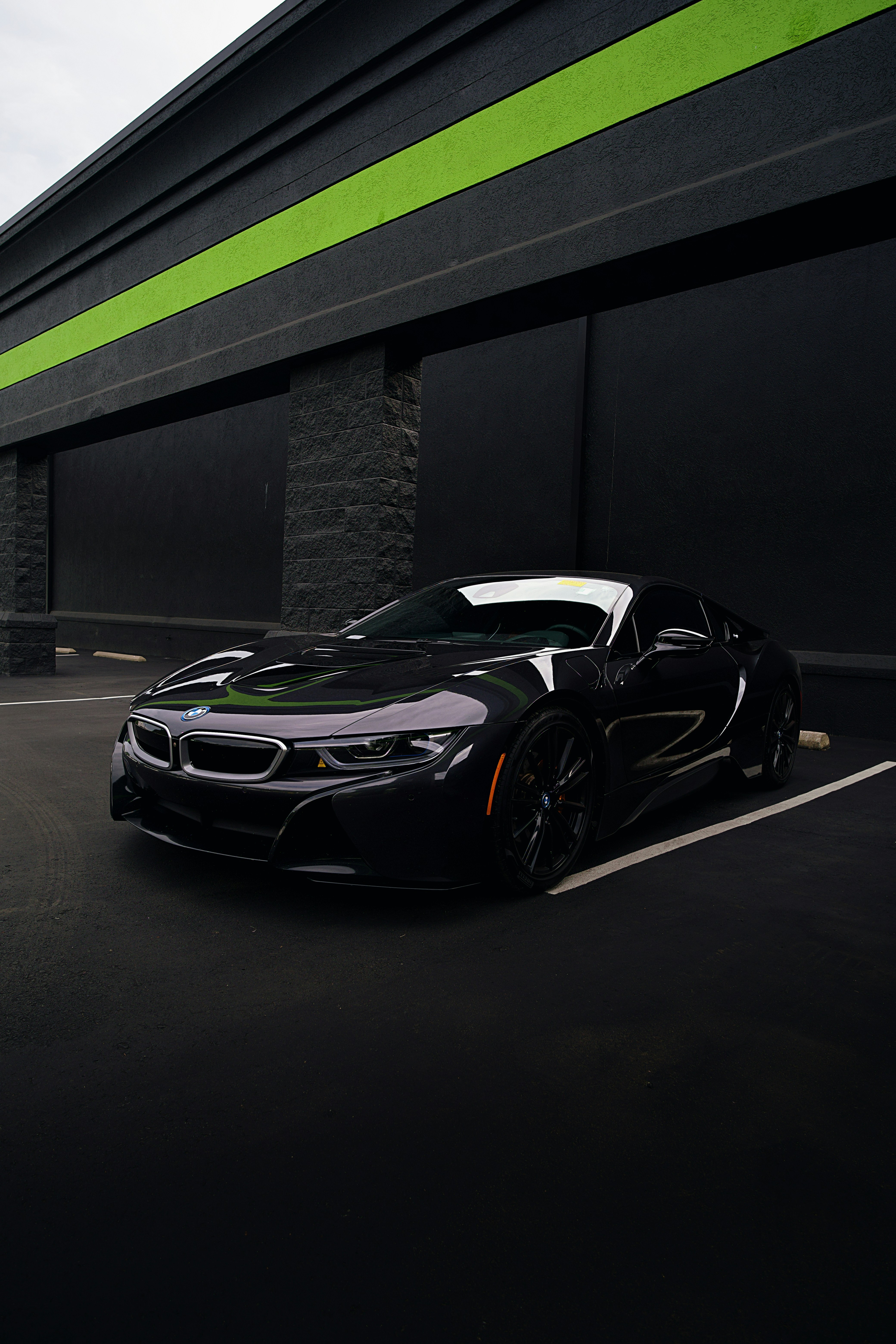 A sleek black sports car parked outdoors. photo – Free Car Image on ...