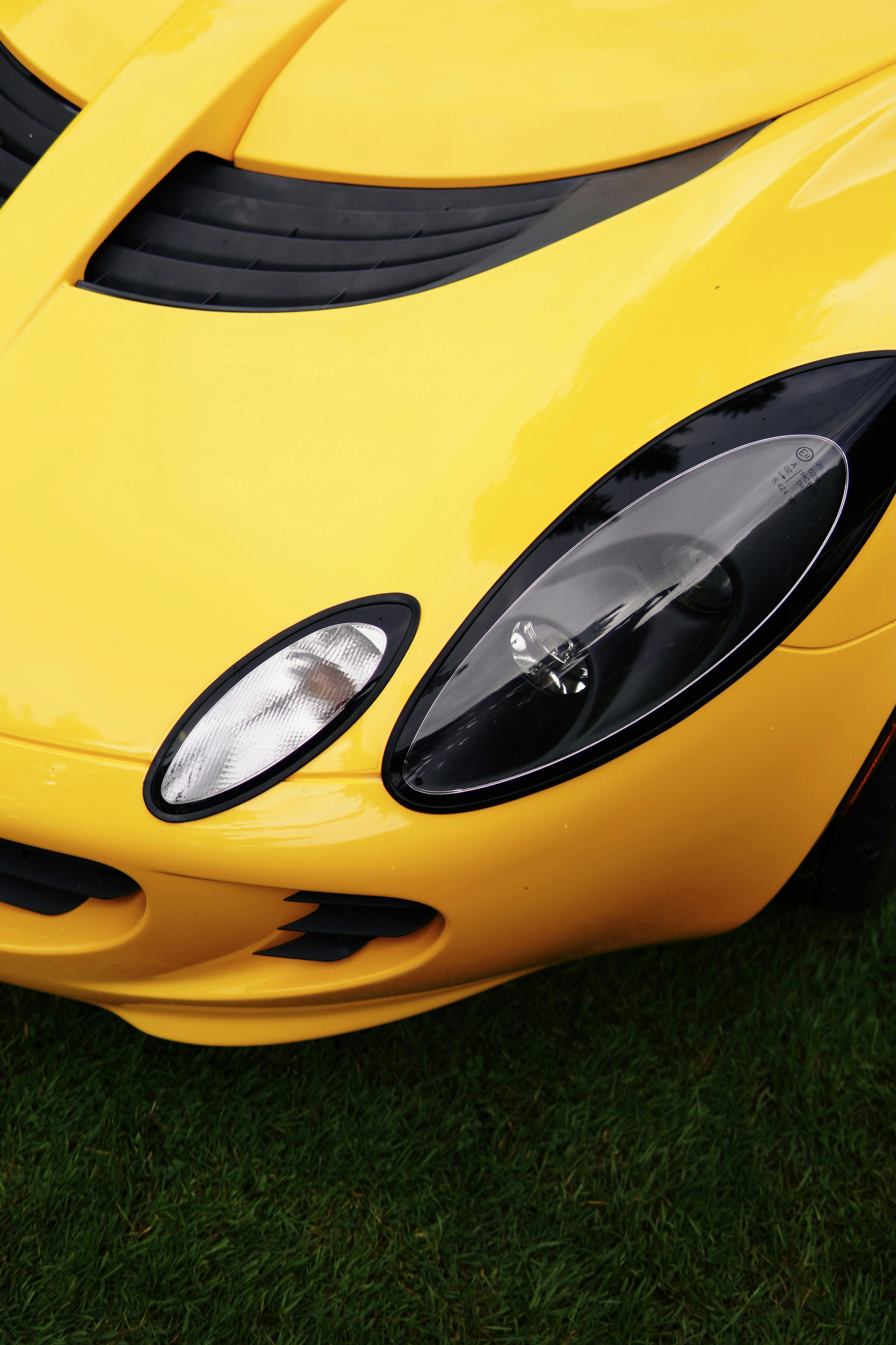 Vibrant Curves: Close-up of a Yellow Exotic Car Corner