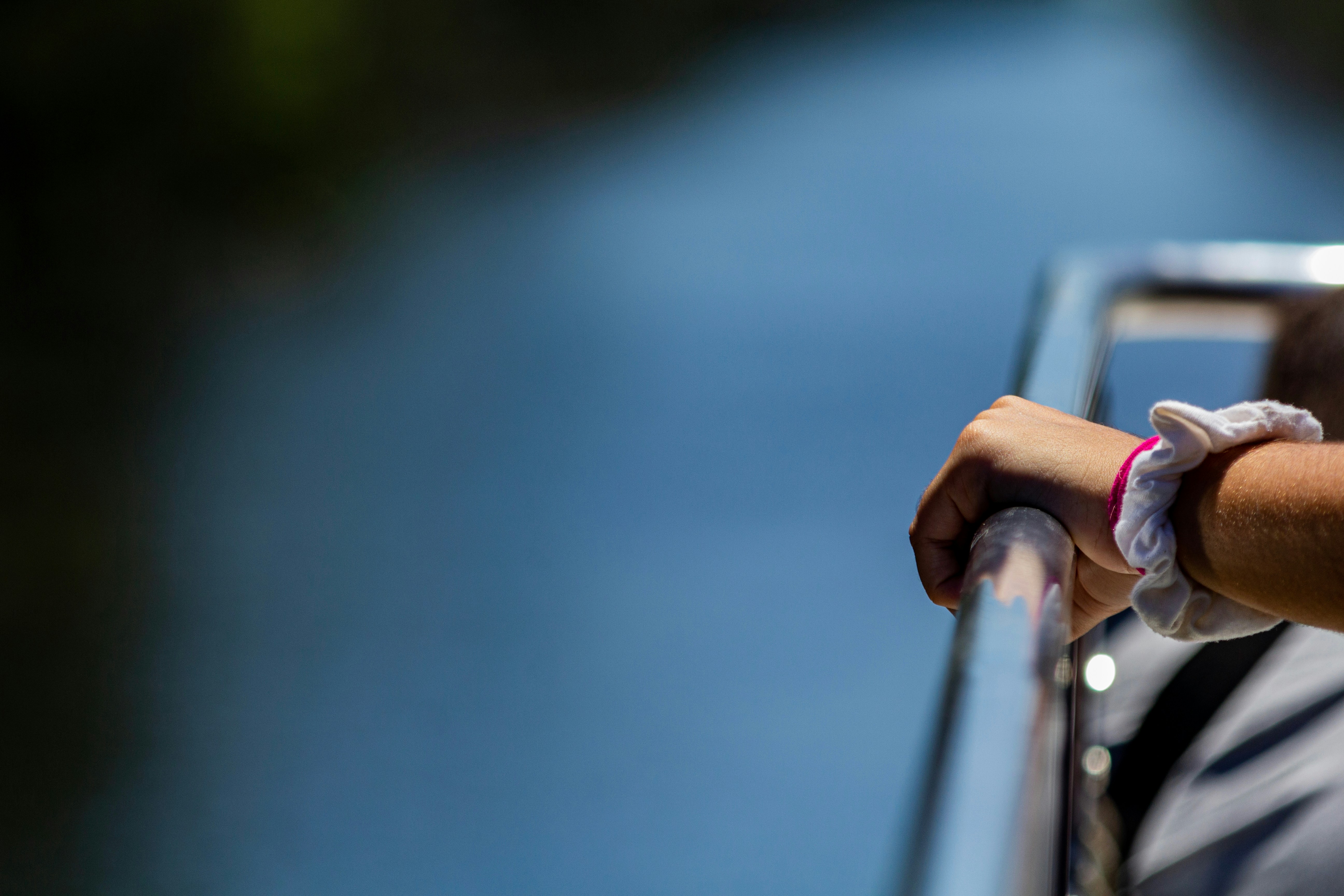 Hands on the Rail: A Moment of Quiet on the Canal