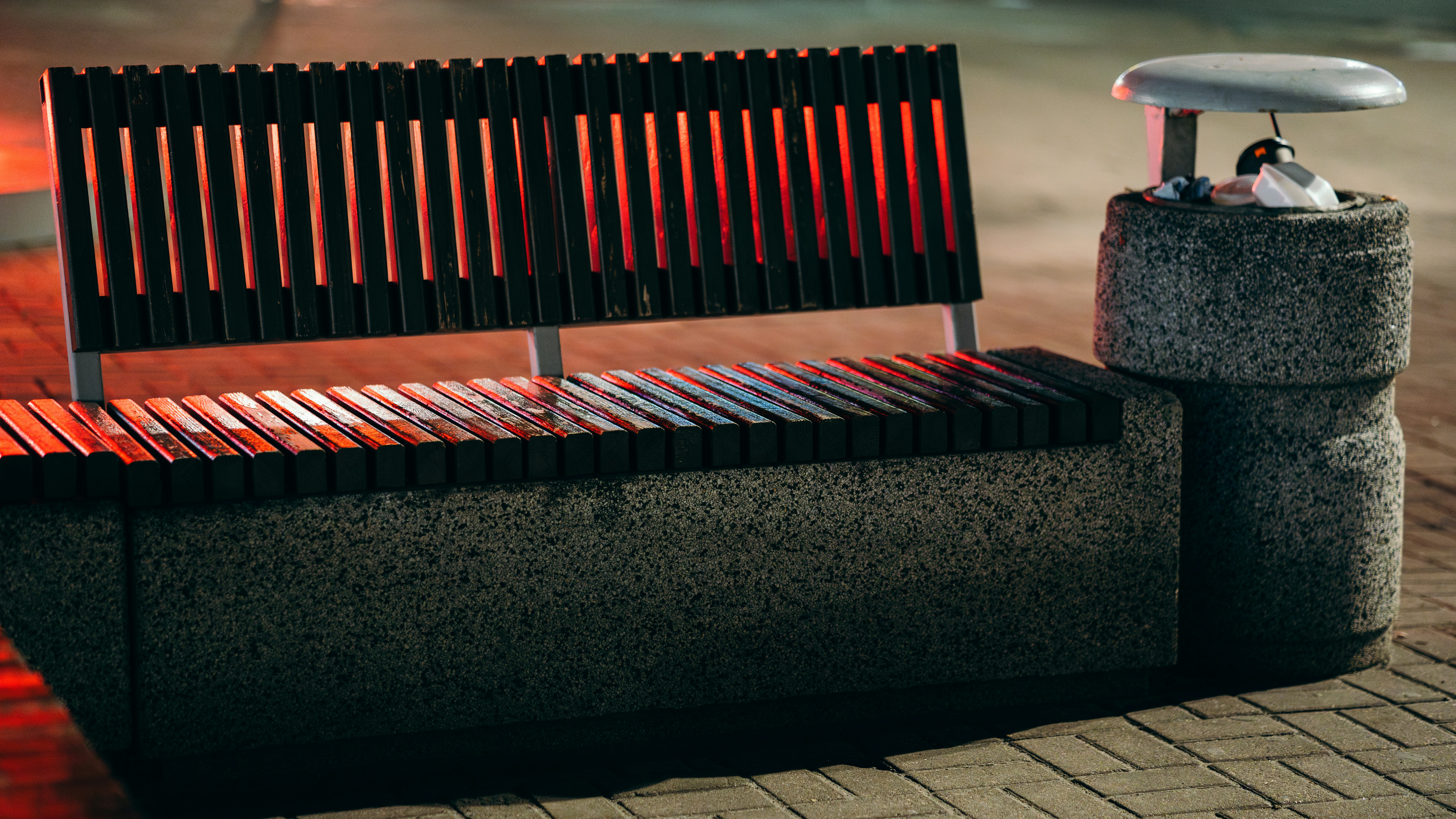 Red-Gridded Bench Under Streetlight Glow